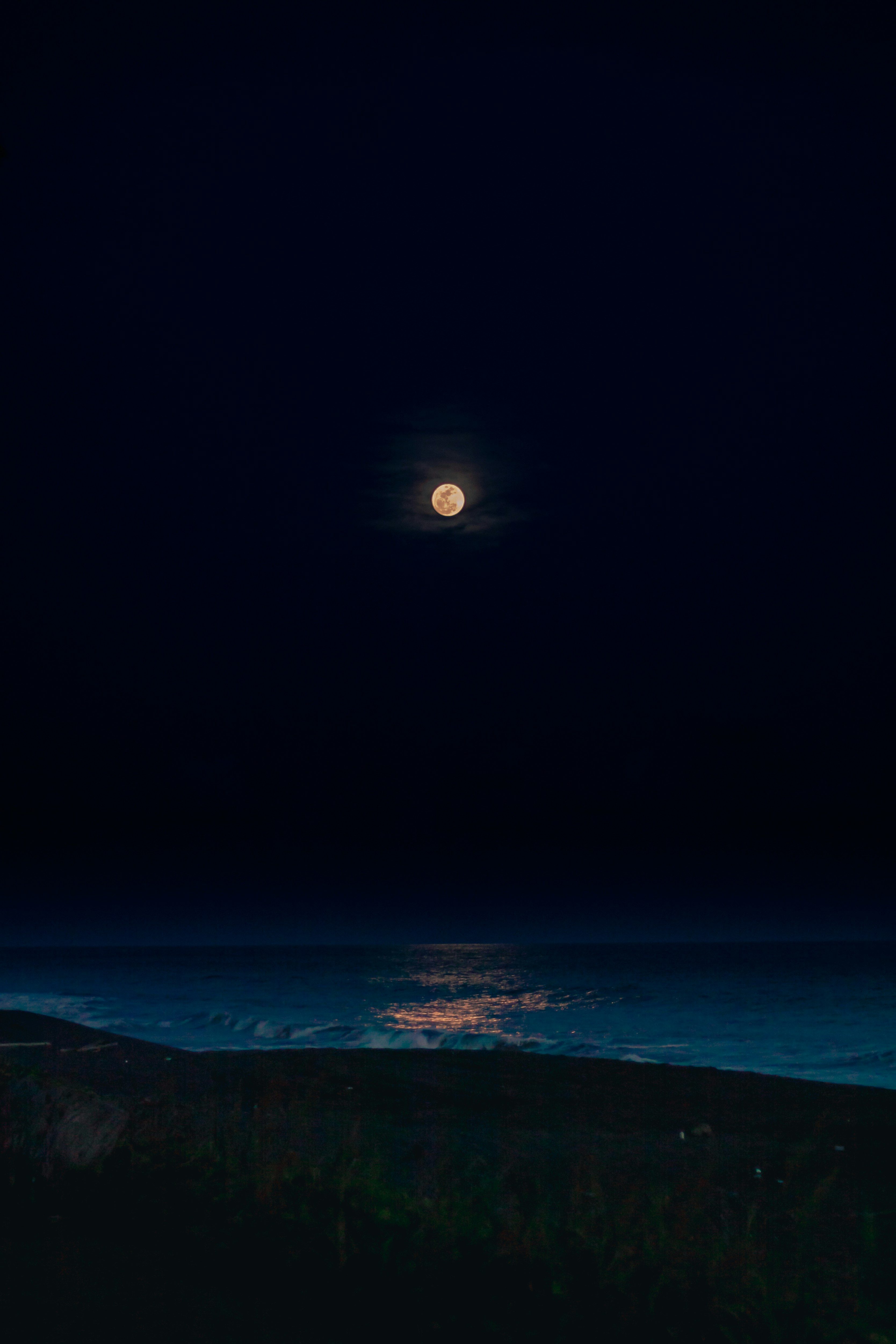 Moonlit Crest Over Quiet Seas
