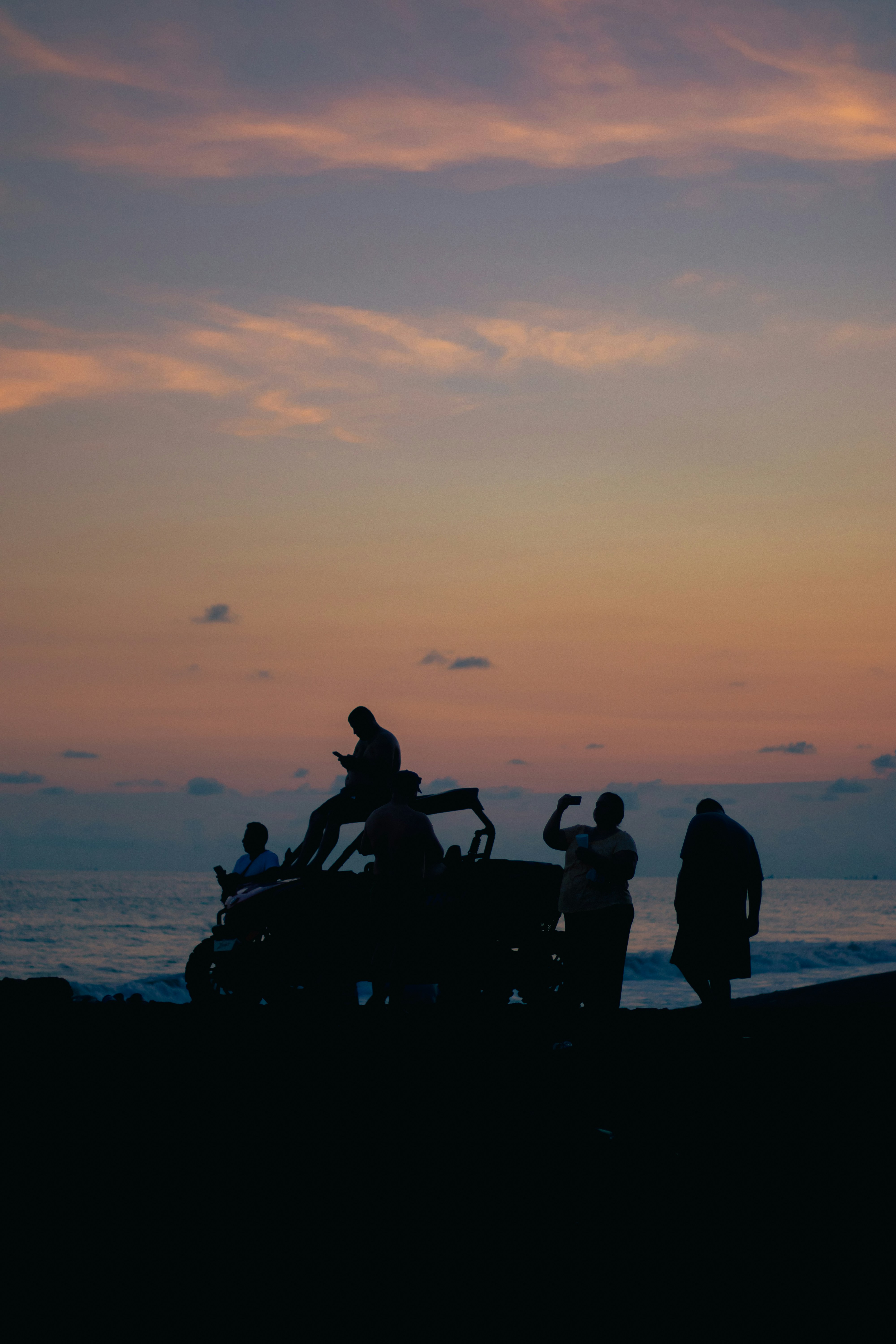 Sunset Silhouette: A Quiet Convergence by the Shore