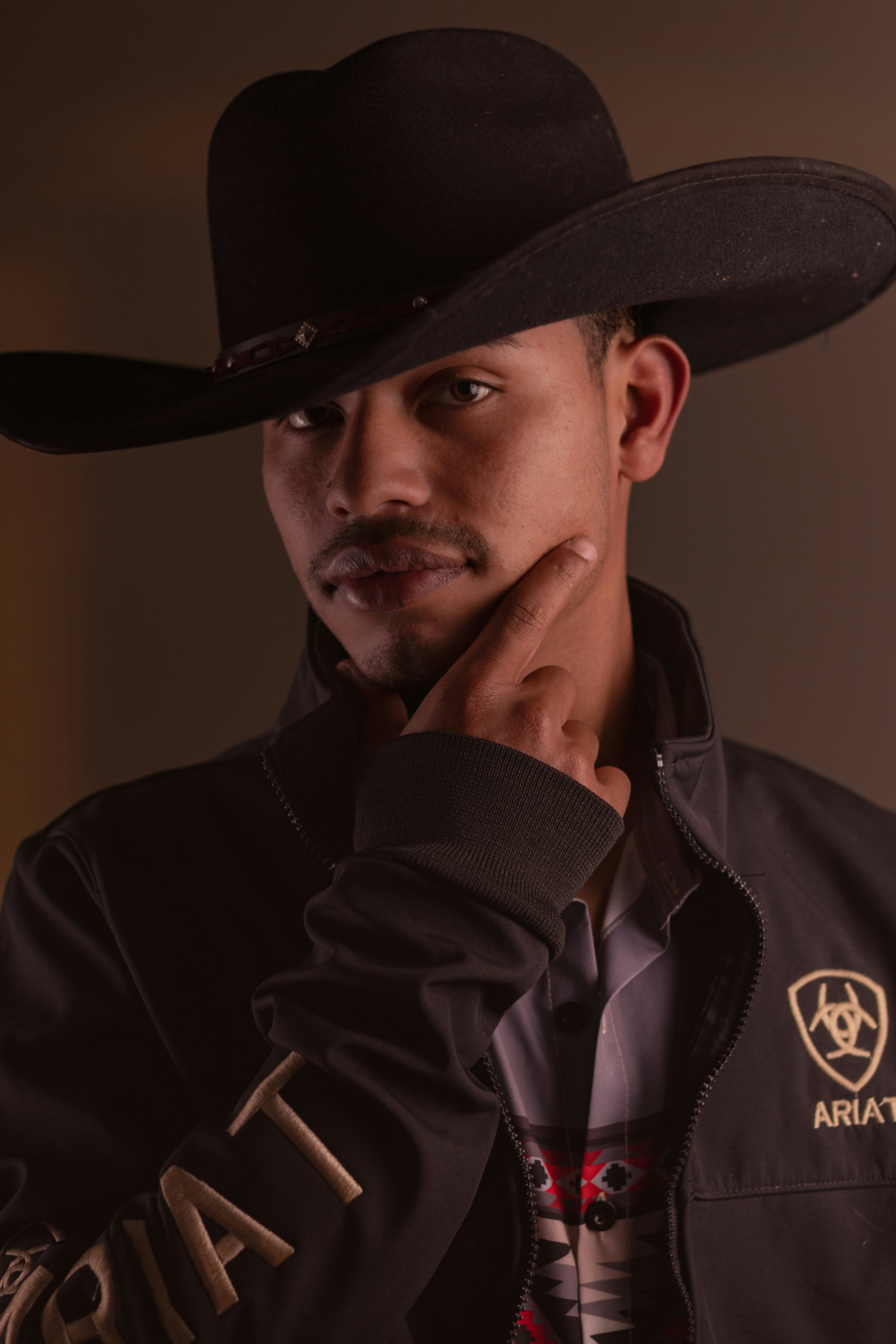Shadowed Cowboy Portrait with Contemplative Gaze