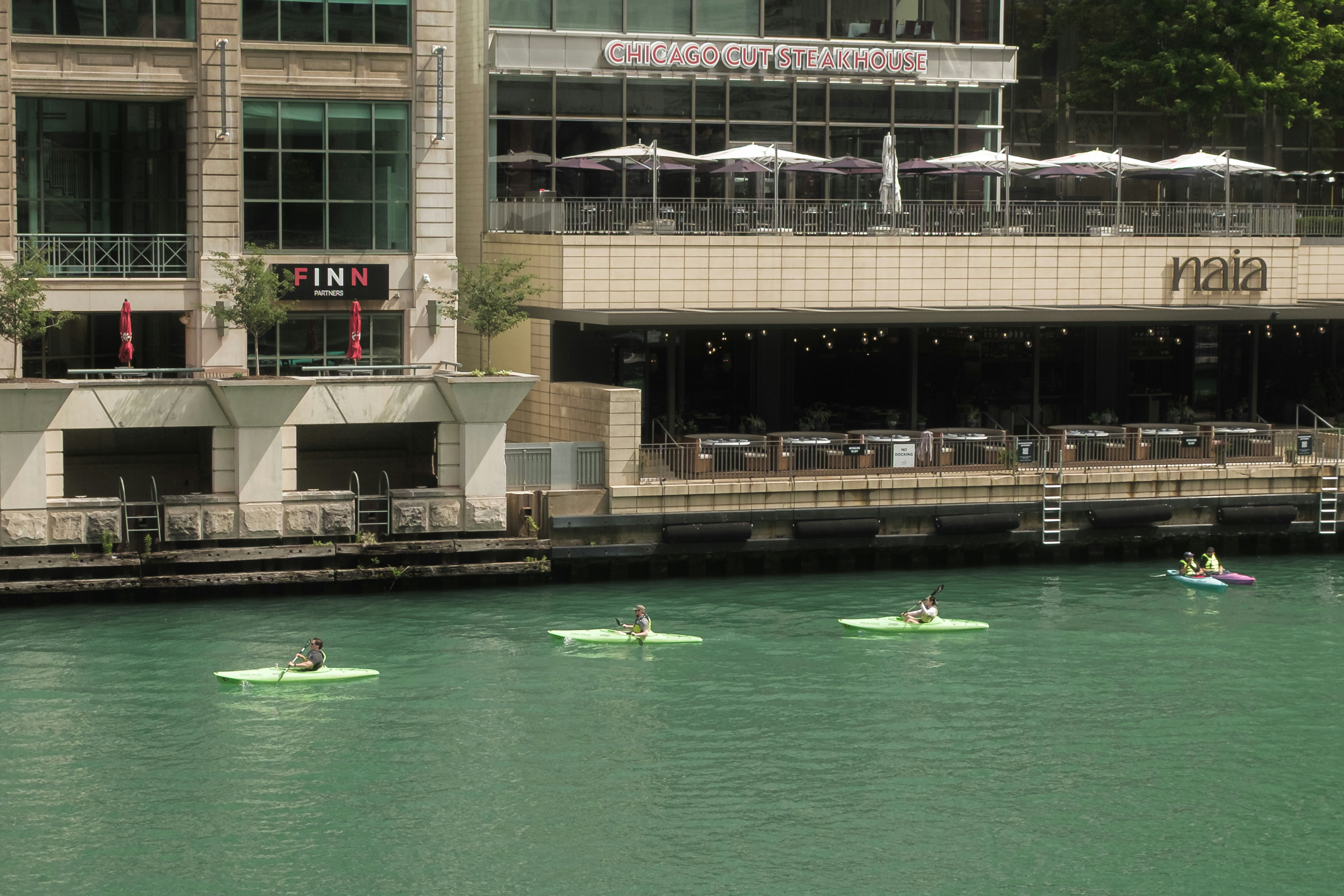 Riverfront Kayaks and Urban Facade