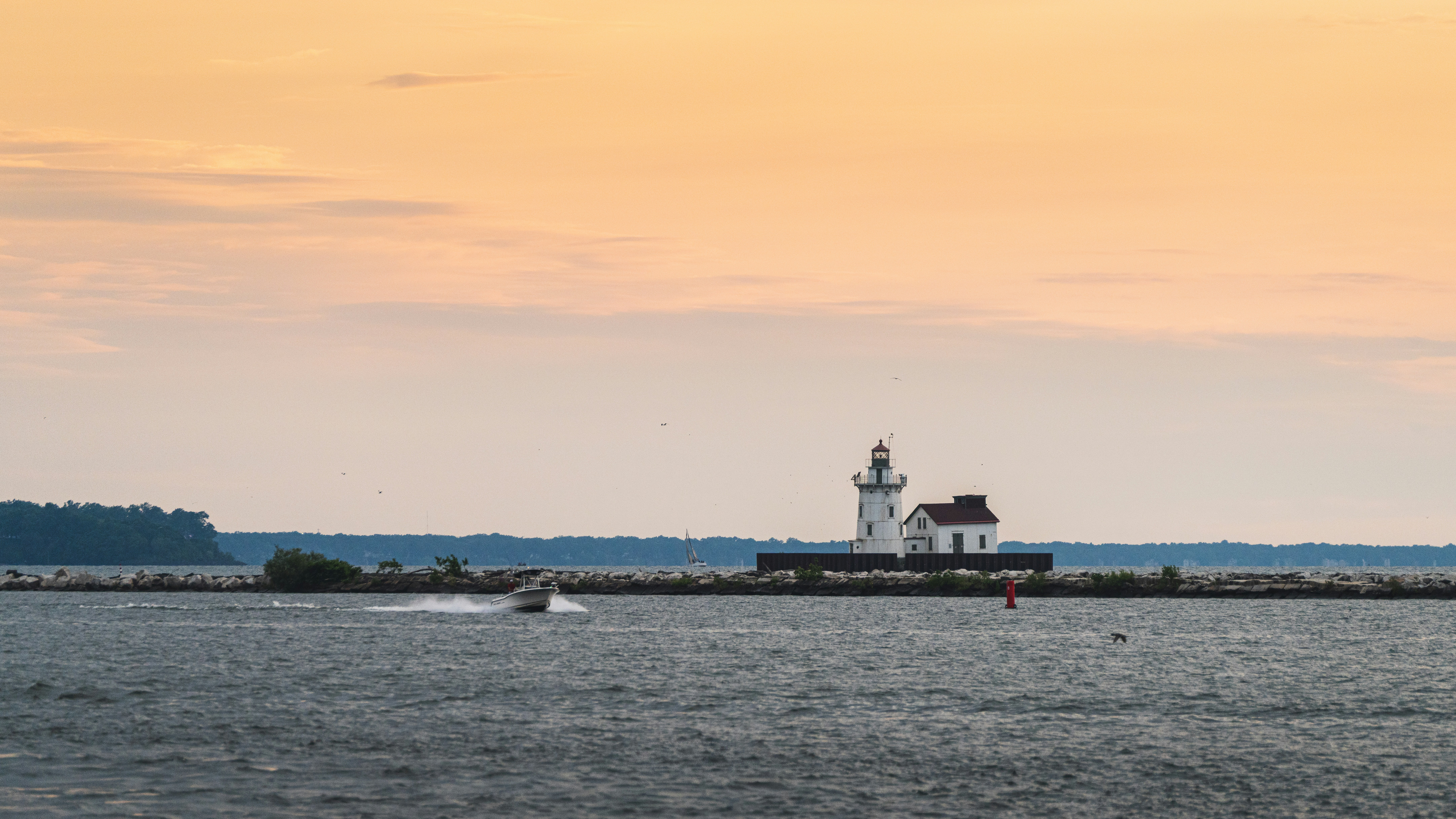 Harbor Beacon at Dusk: Lighthouse guarding the inlet