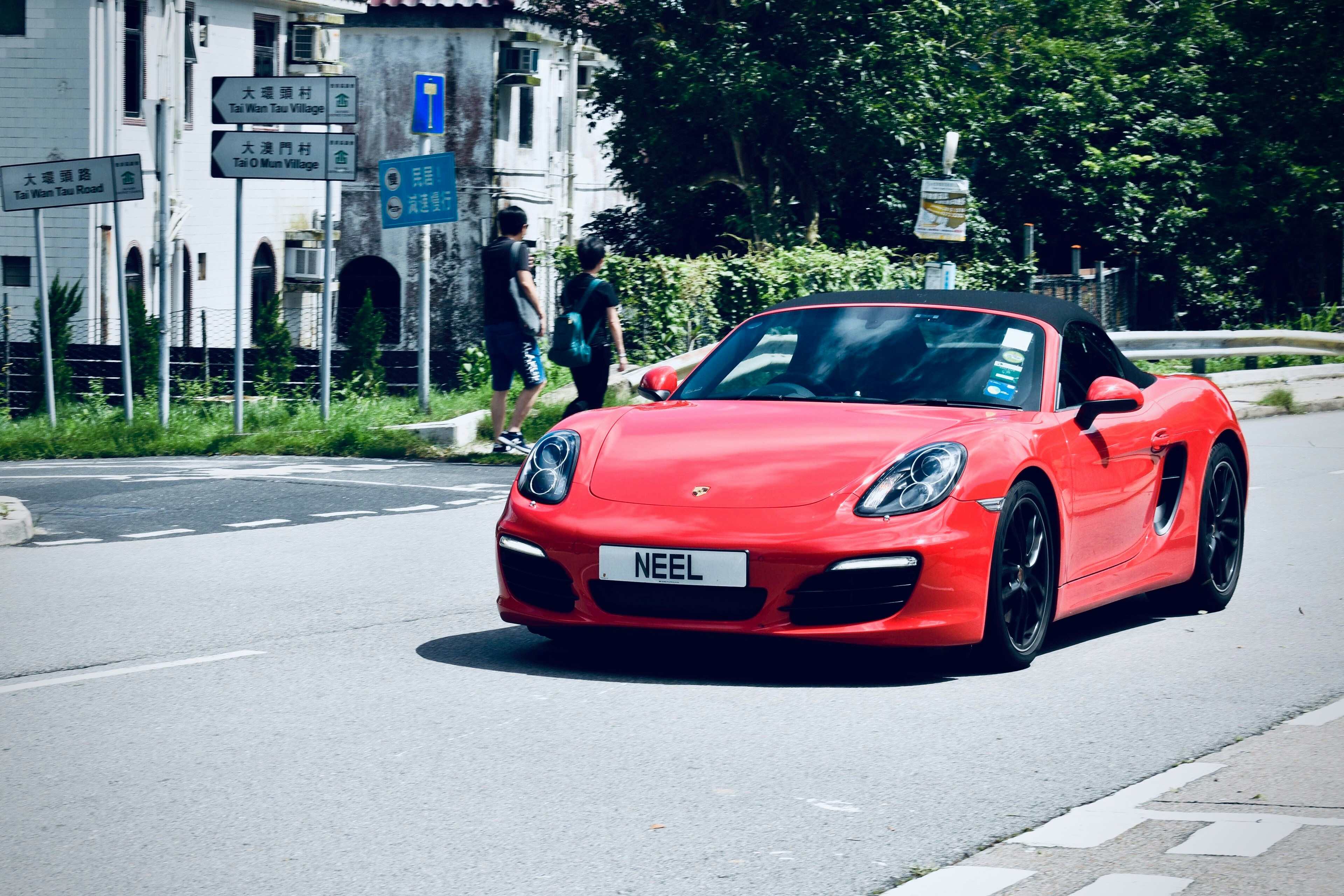 Scarlet Renault: A Convertible Red Car on a Sunlit Street
