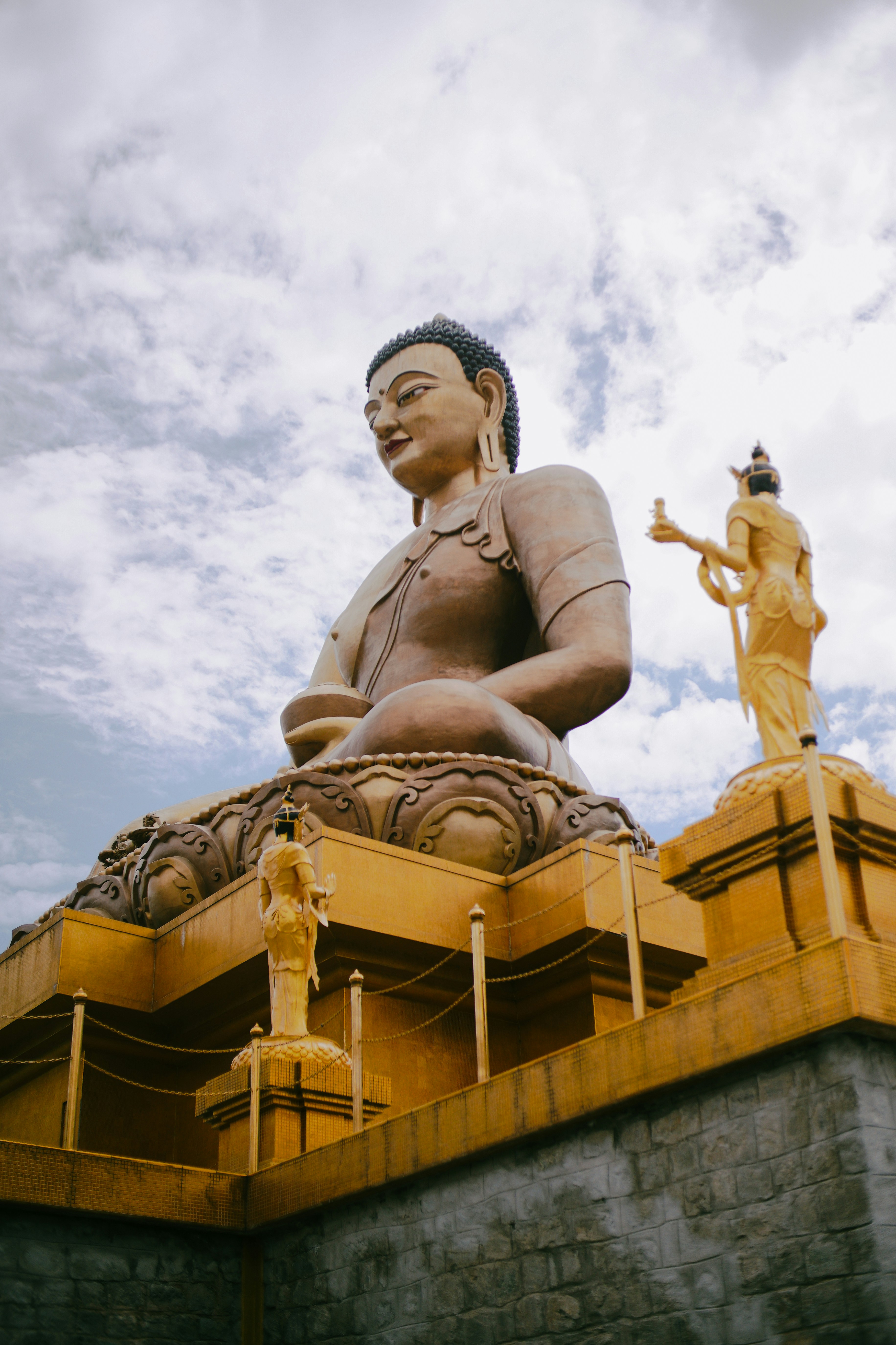 Quiet Majesty: A Sacred Buddha Surrounded by Golden Statues