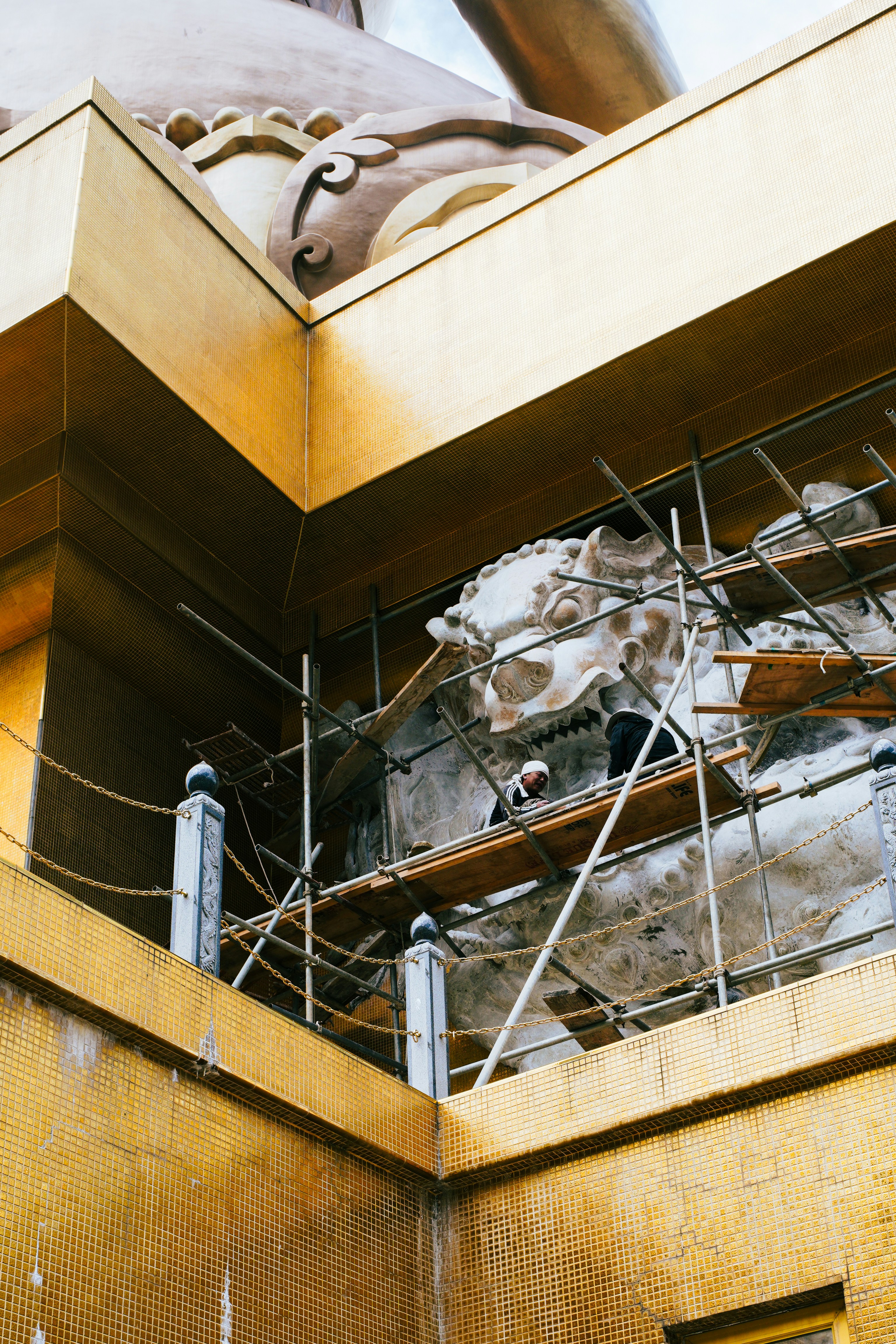 Under construction: scaffolding against a golden architectural façade