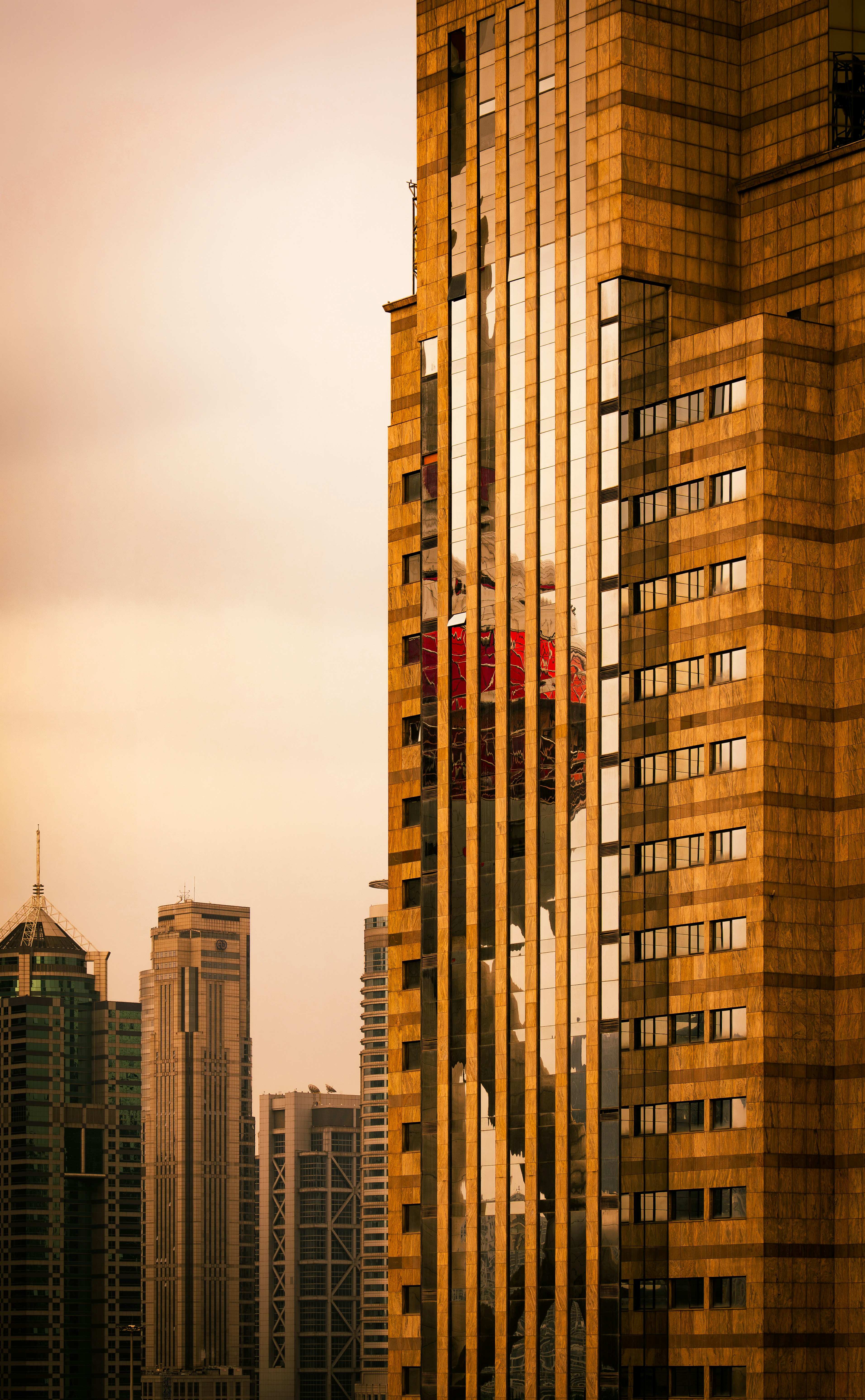 Gold Facade, Silent Skyscraper: A Vertical Portrait of Reflections