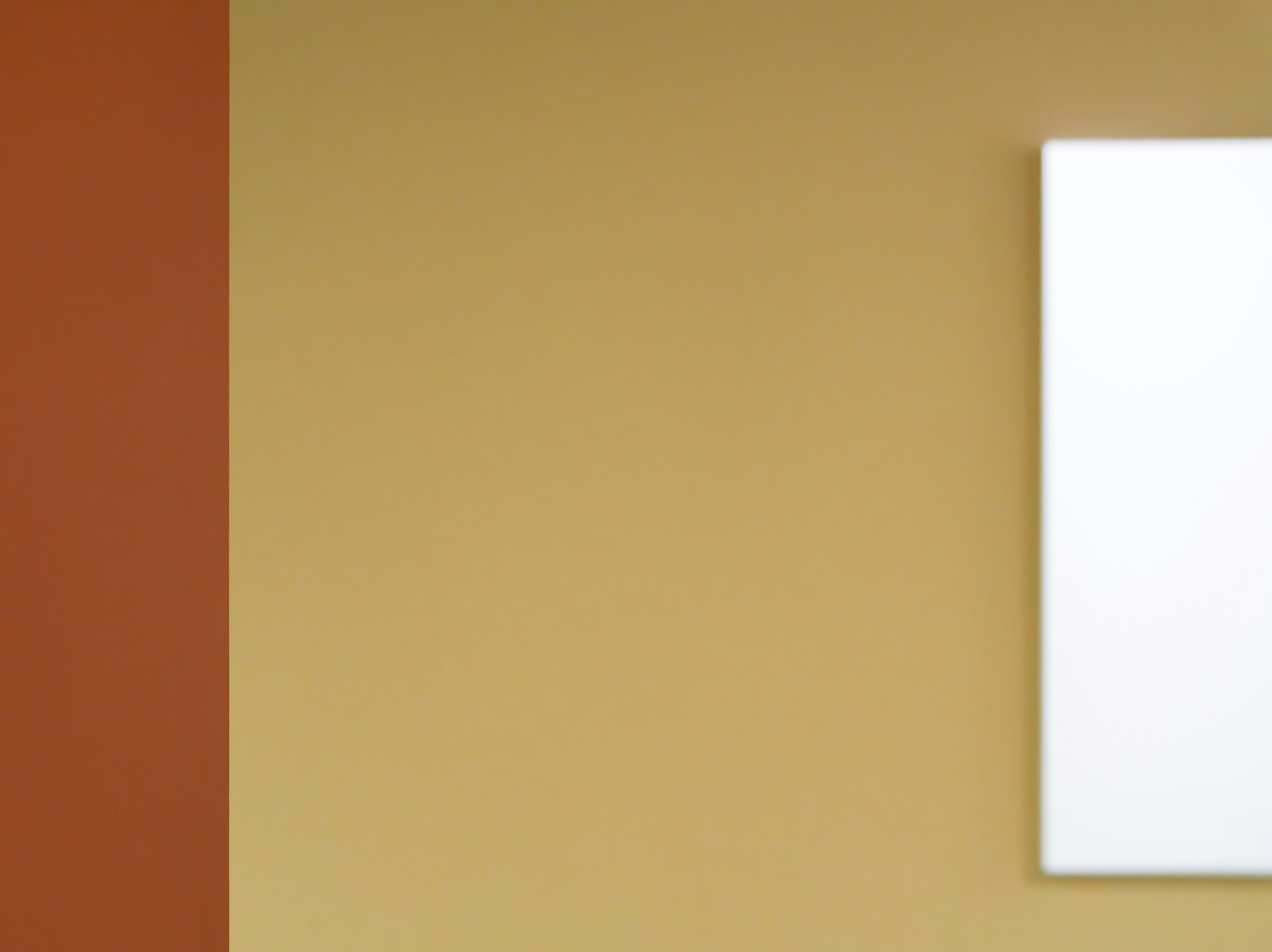 Minimal Warmth: A Tan Wall with a Bright White Edge