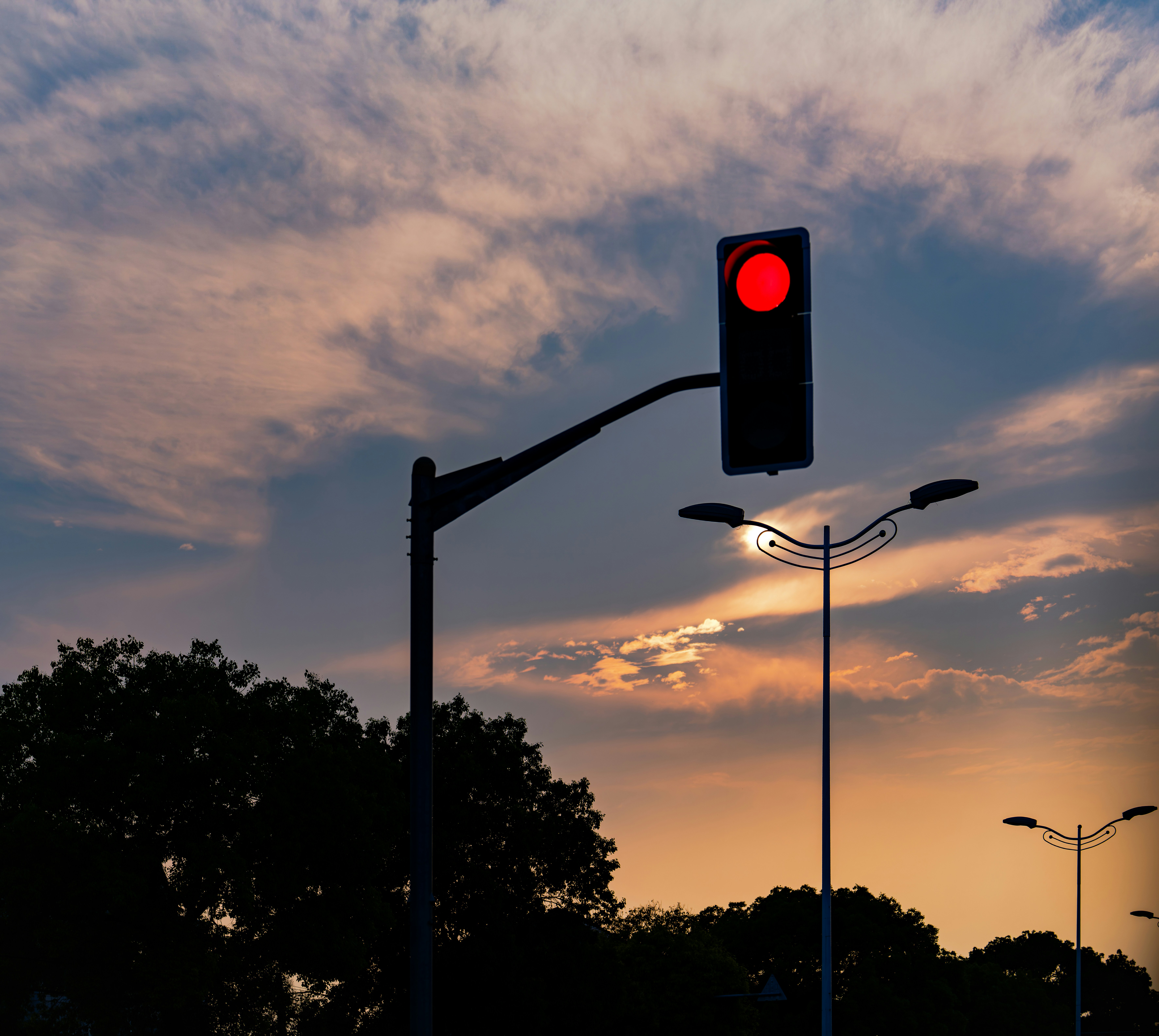 Red Signal, Silent Horizon: Evening Street Lamps and Sunset