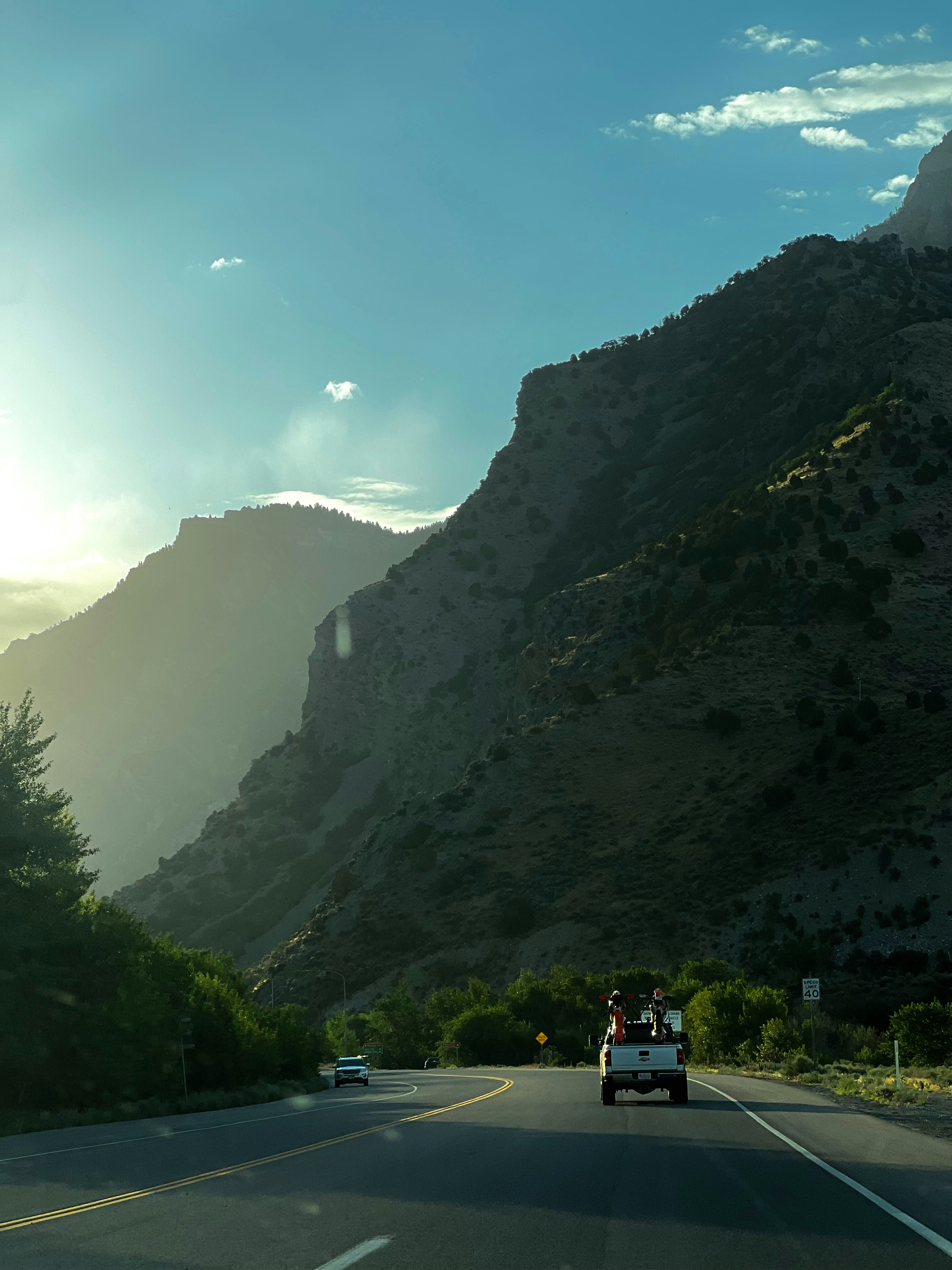 Sunlit Highway Through a Shadowed Canyon