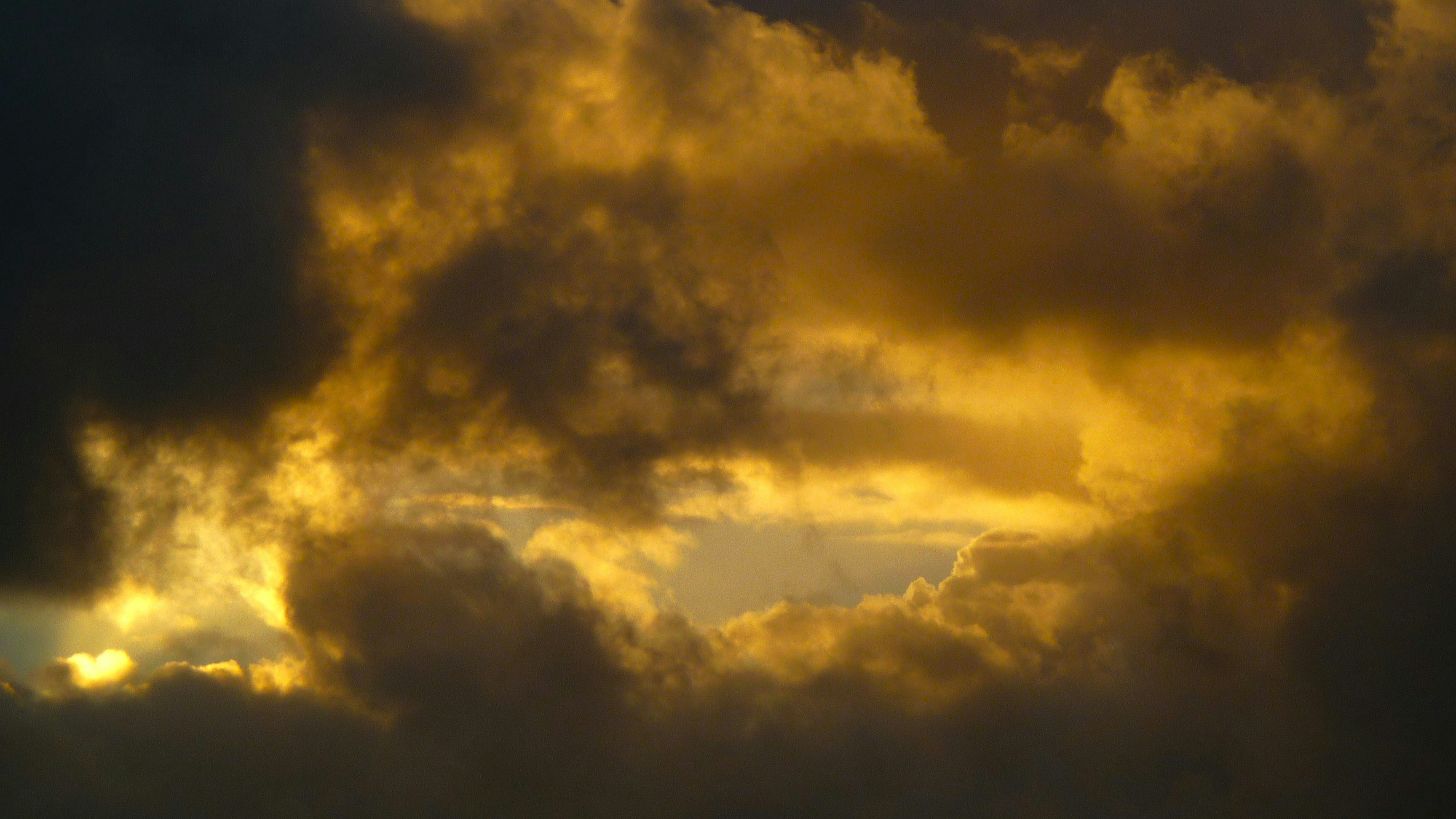 Sunlight Piercing Through Velvet Clouds at Dusk
