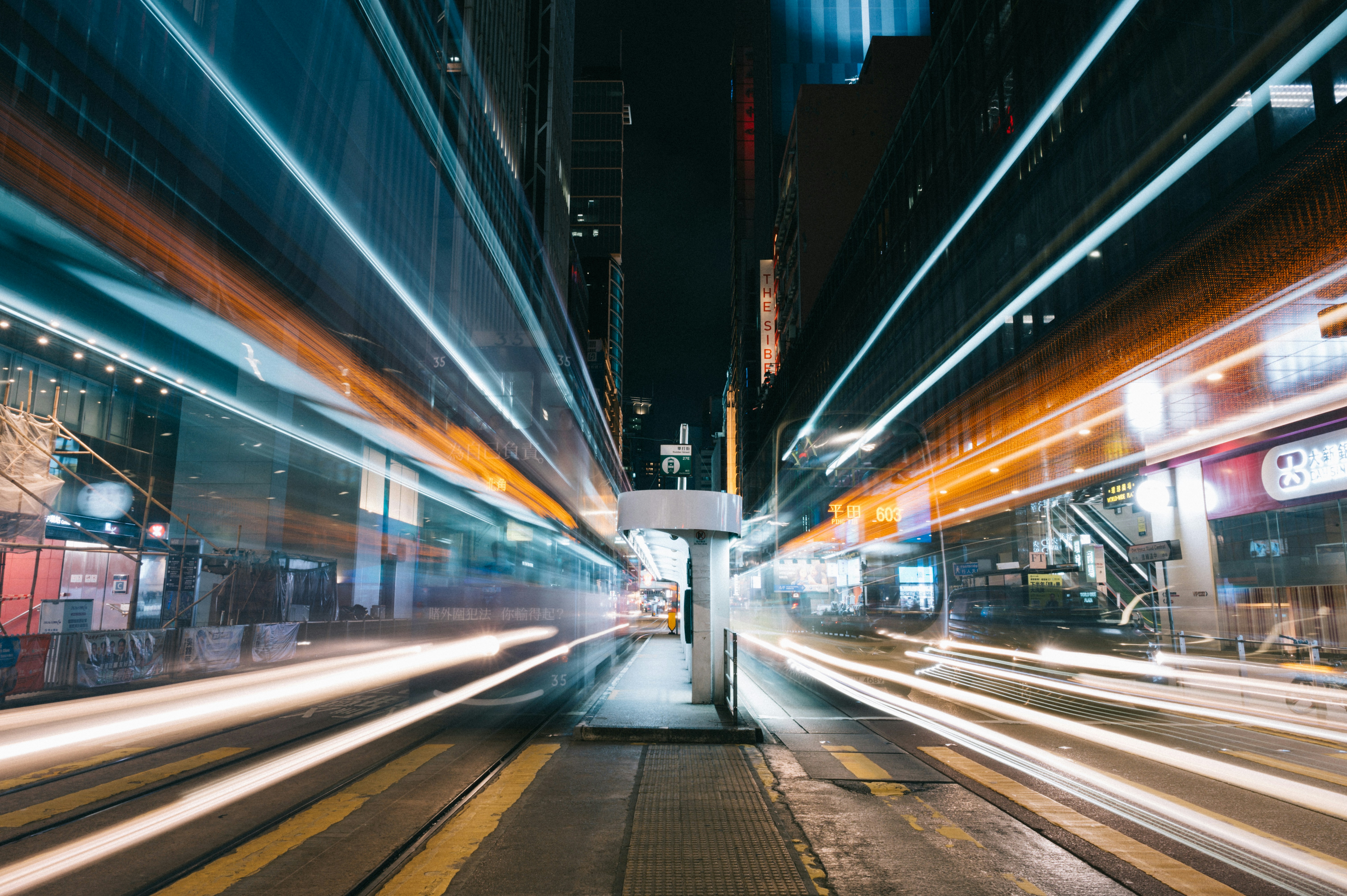 Rush Hour Tunnel: Neon Trails Through a City Corridor