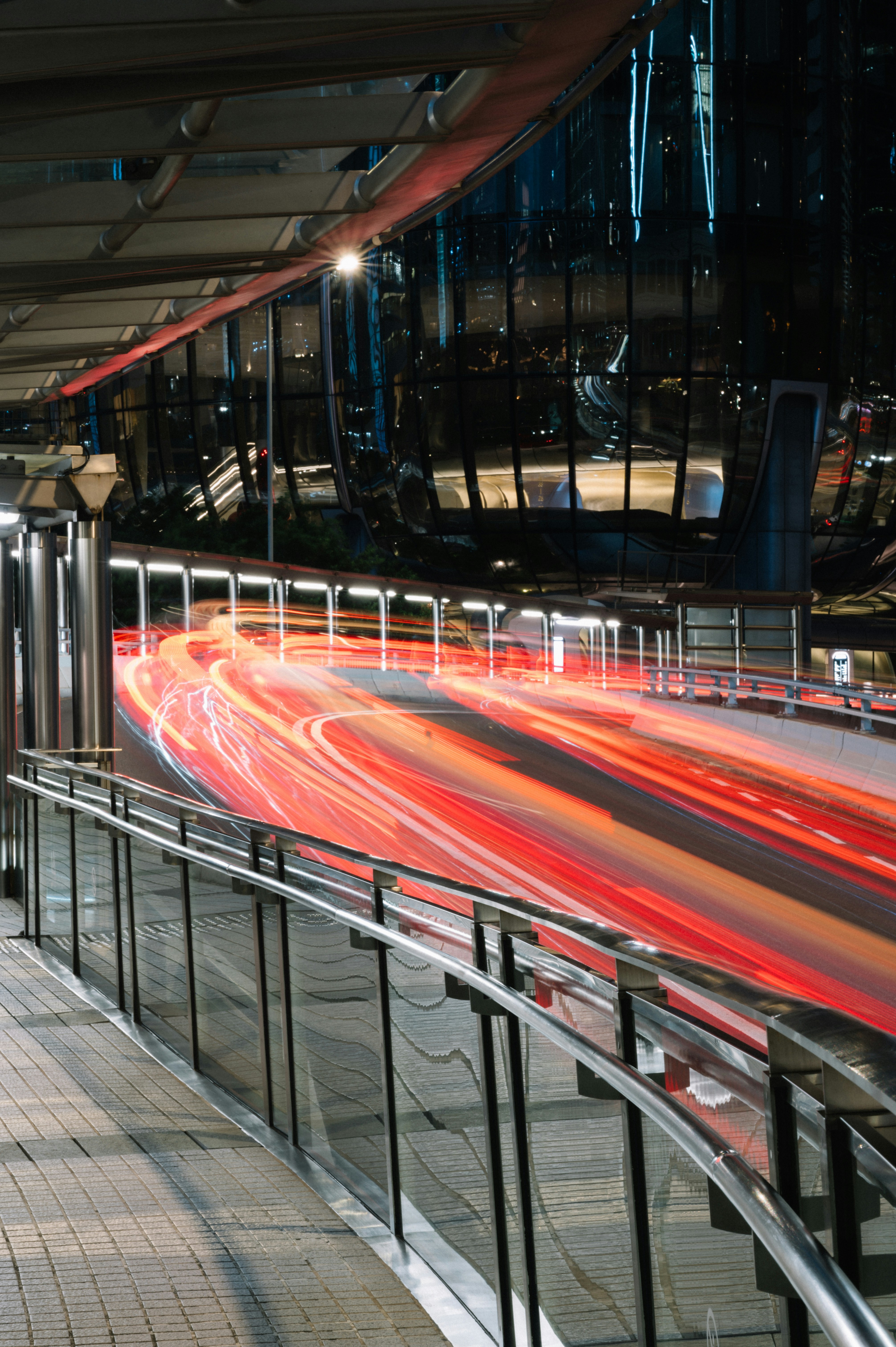 Neon Ribbon: Long Exposure Through a Modern Portal