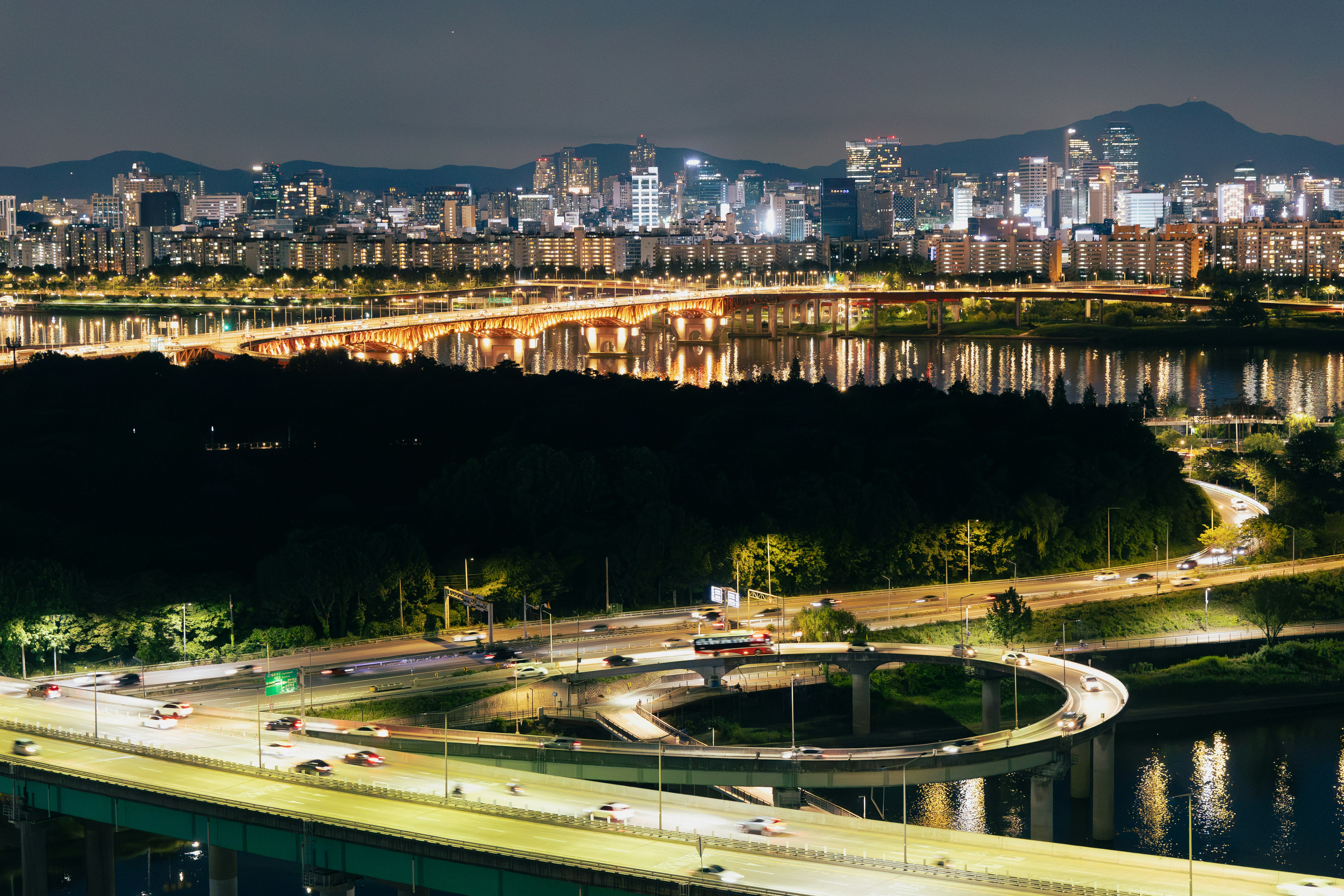 Nighttime City Bridge: Reflections and Ribbons of Light