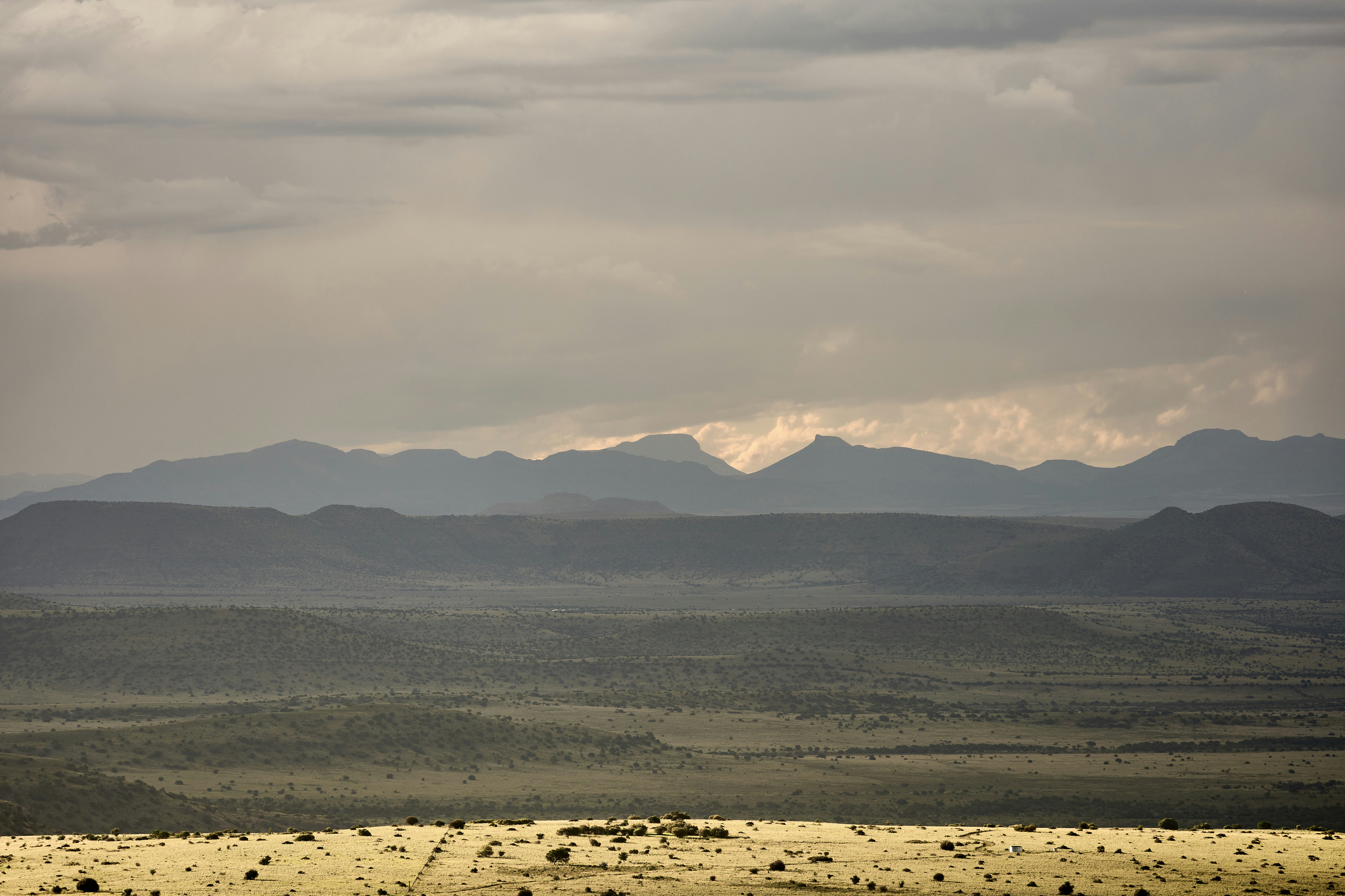 Desert Horizons Beneath Layered Dusk