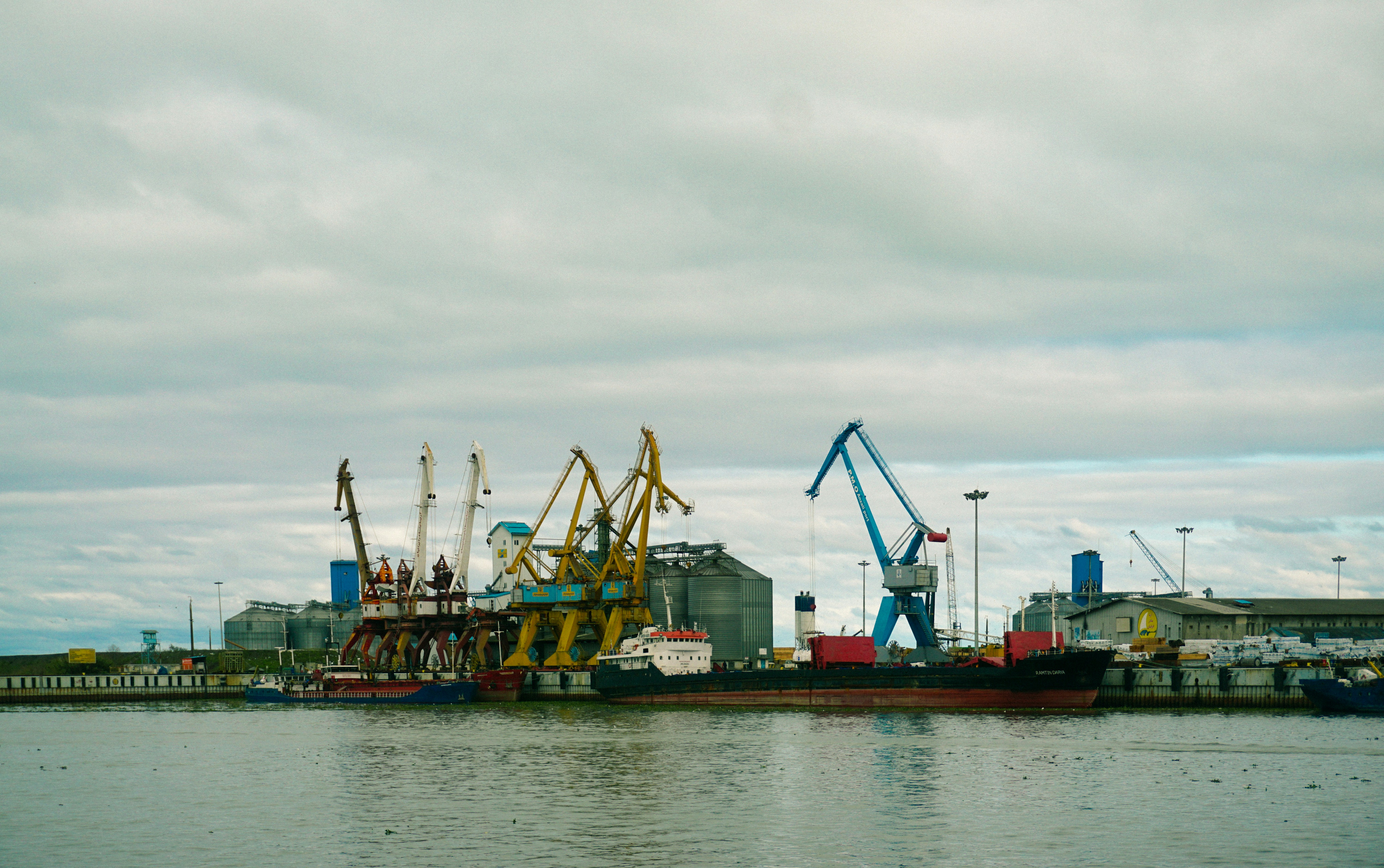 Harbor Giants: Cranes on the Quiet Dock