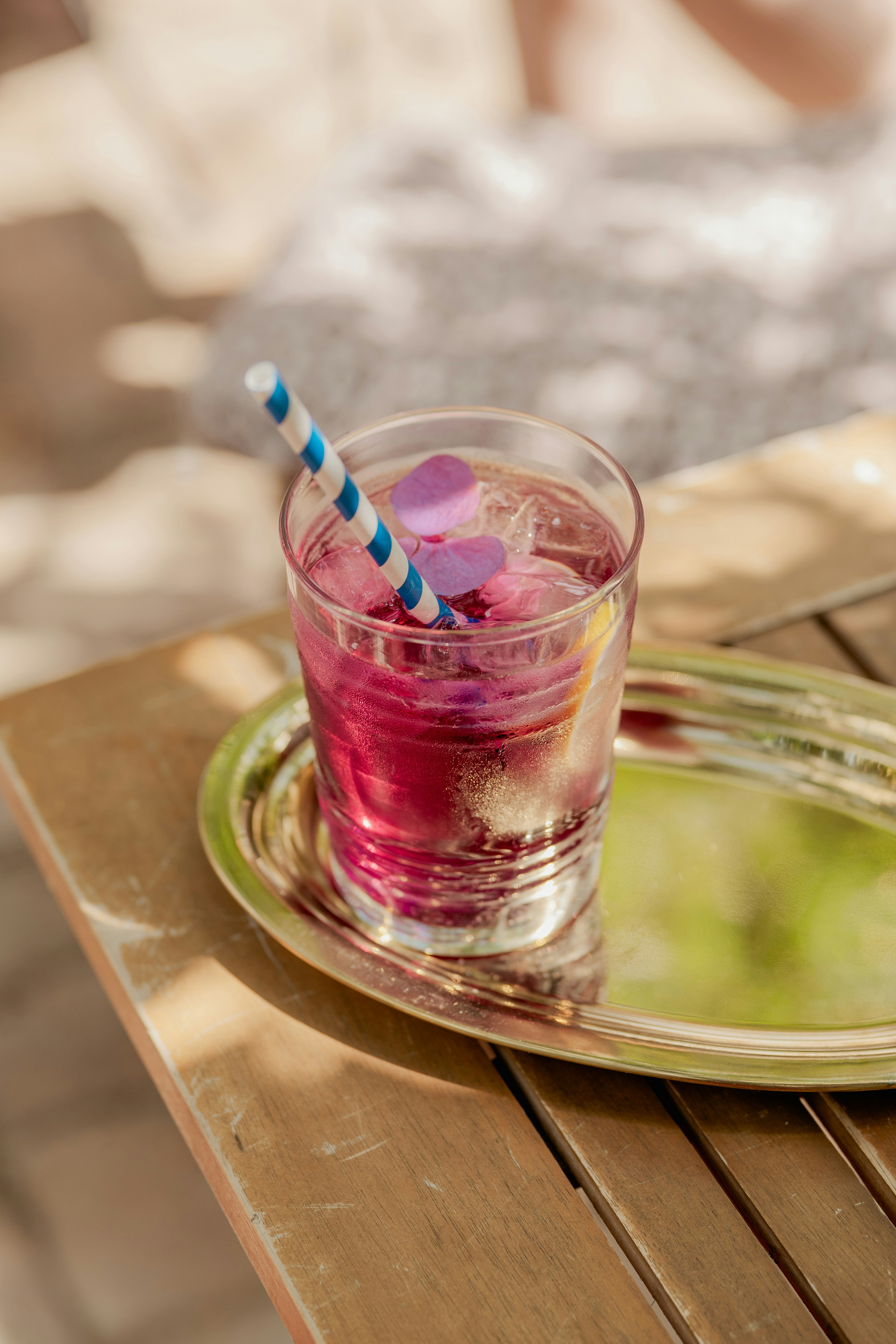 Crimson Sip in Afternoon Light