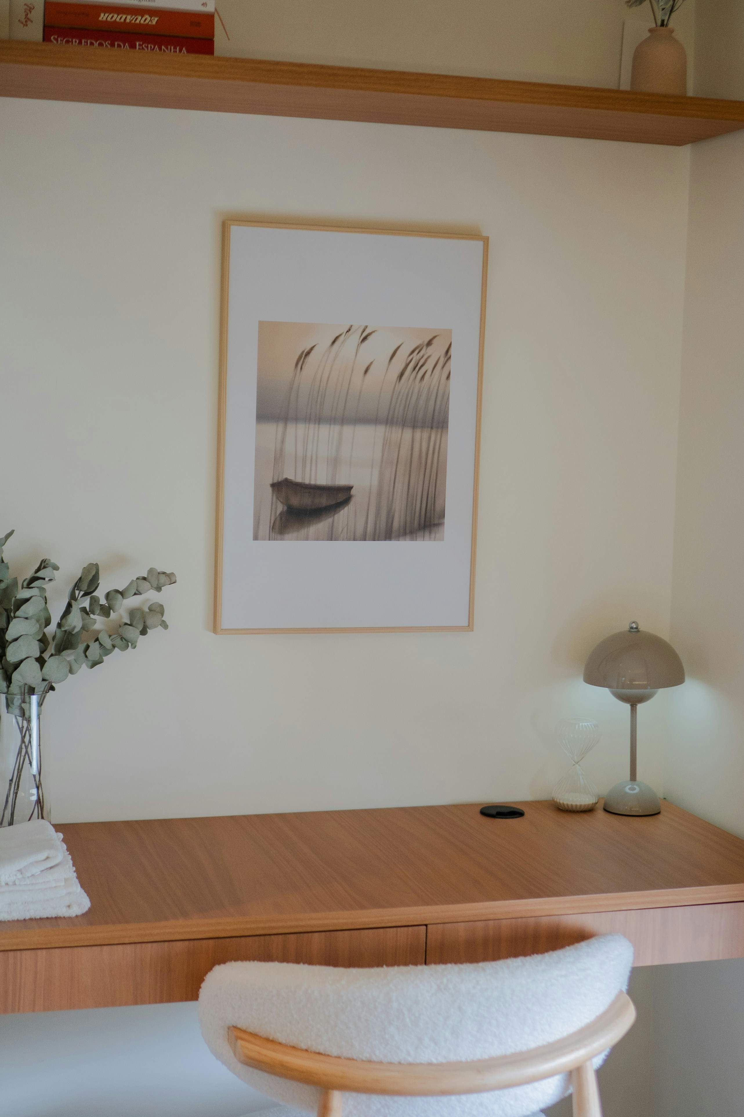 Minimalist Desk Studio: framed artwork above a wooden workspace