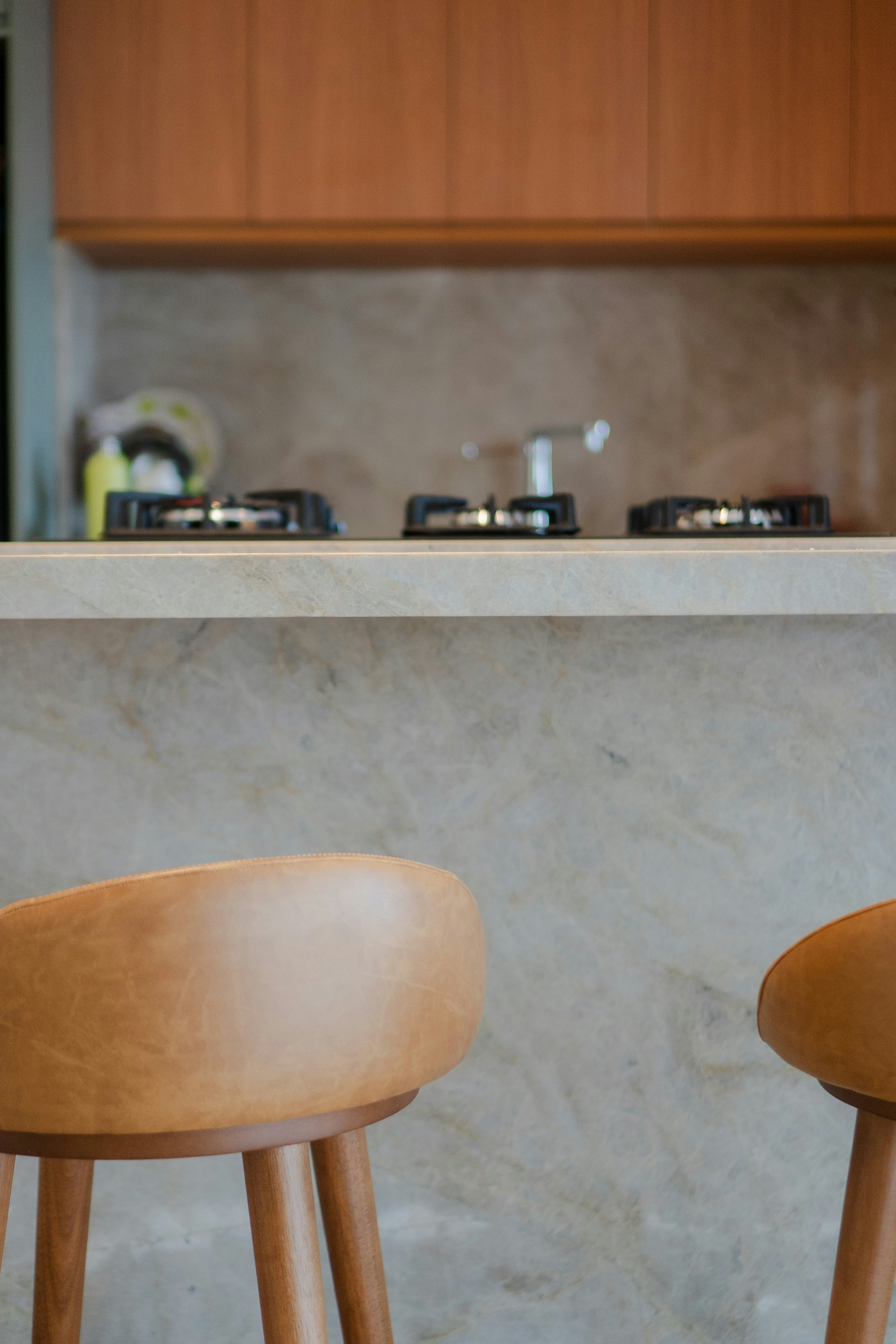 Bare Kitchen Island Backdrop with Ember-Toned Stools