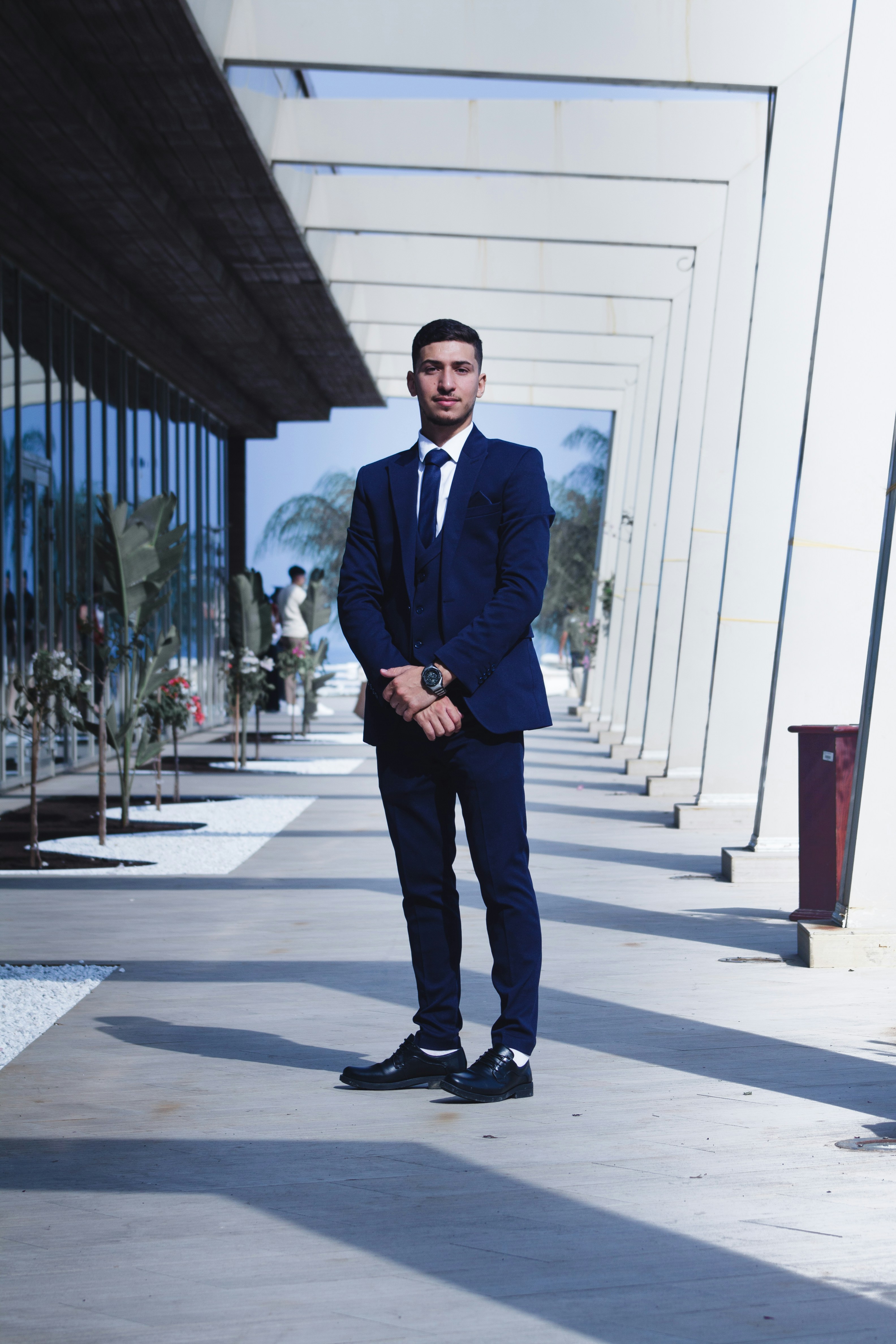 A Moment in the Colonnade: Confidence in a Navy Suit