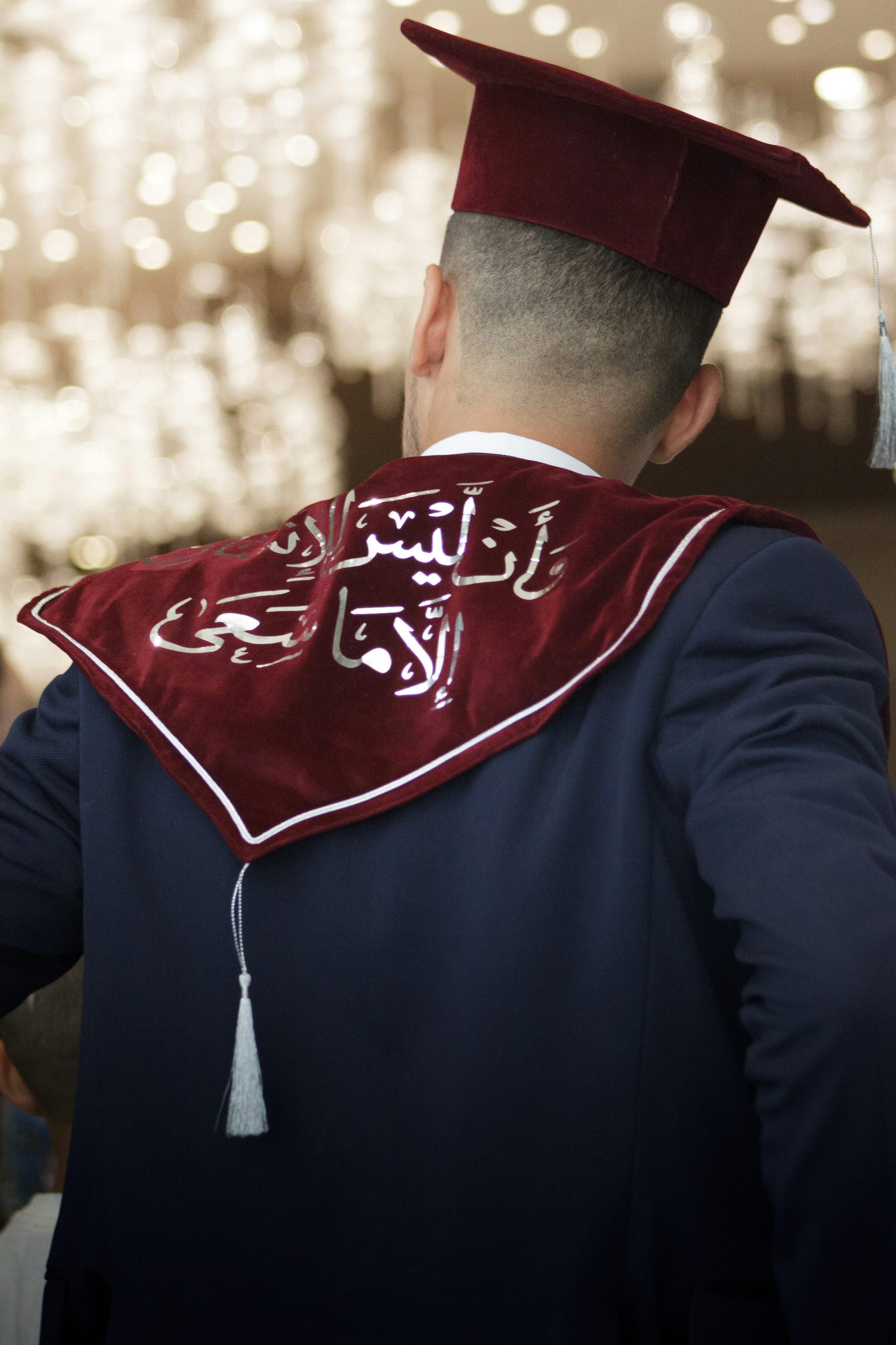 Graduate's Back: Velvet Red Draped Across the Cadet's Shoulders