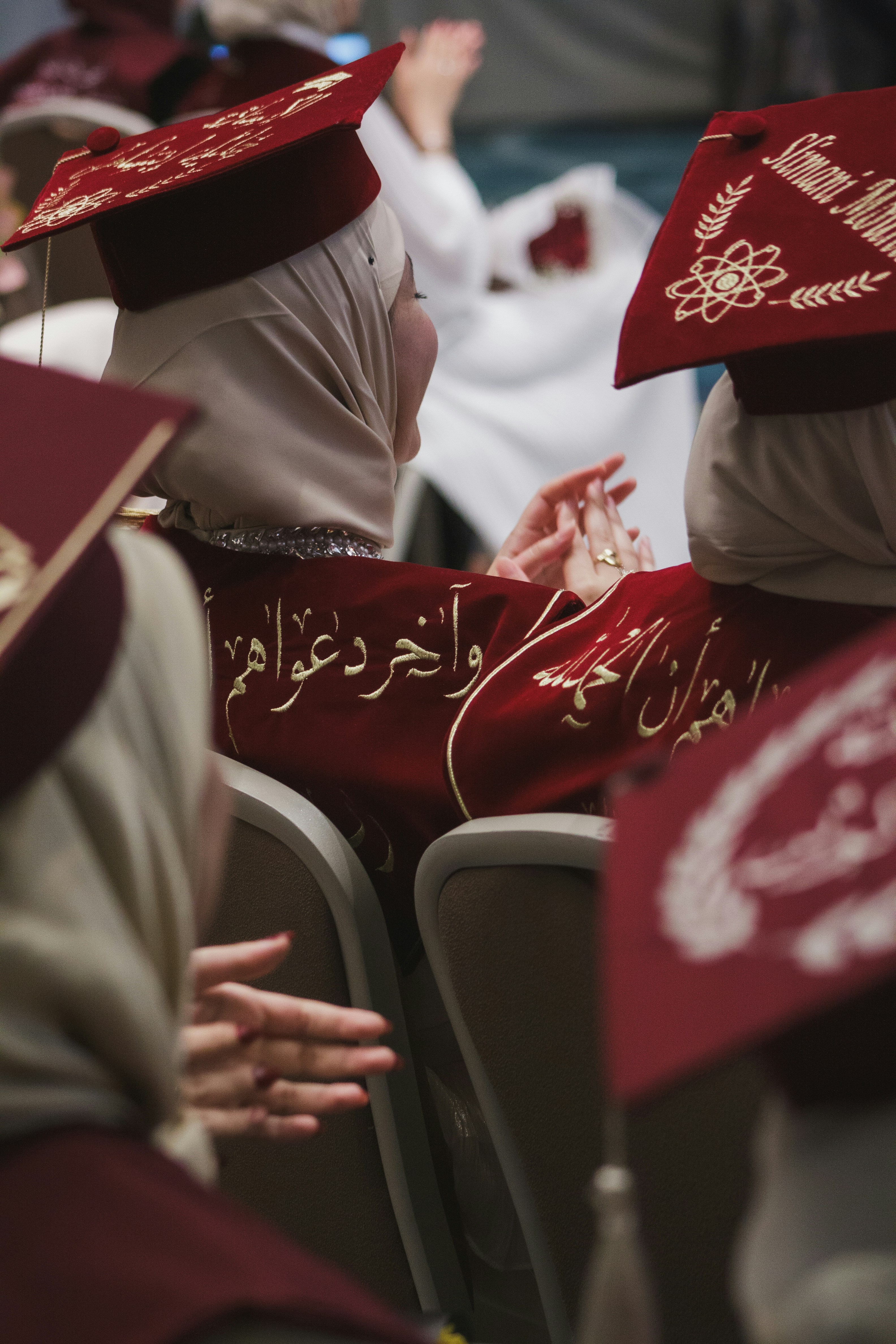 Ceremonial Robes and Sacred Script: A Quiet Moment in Graduation Rows