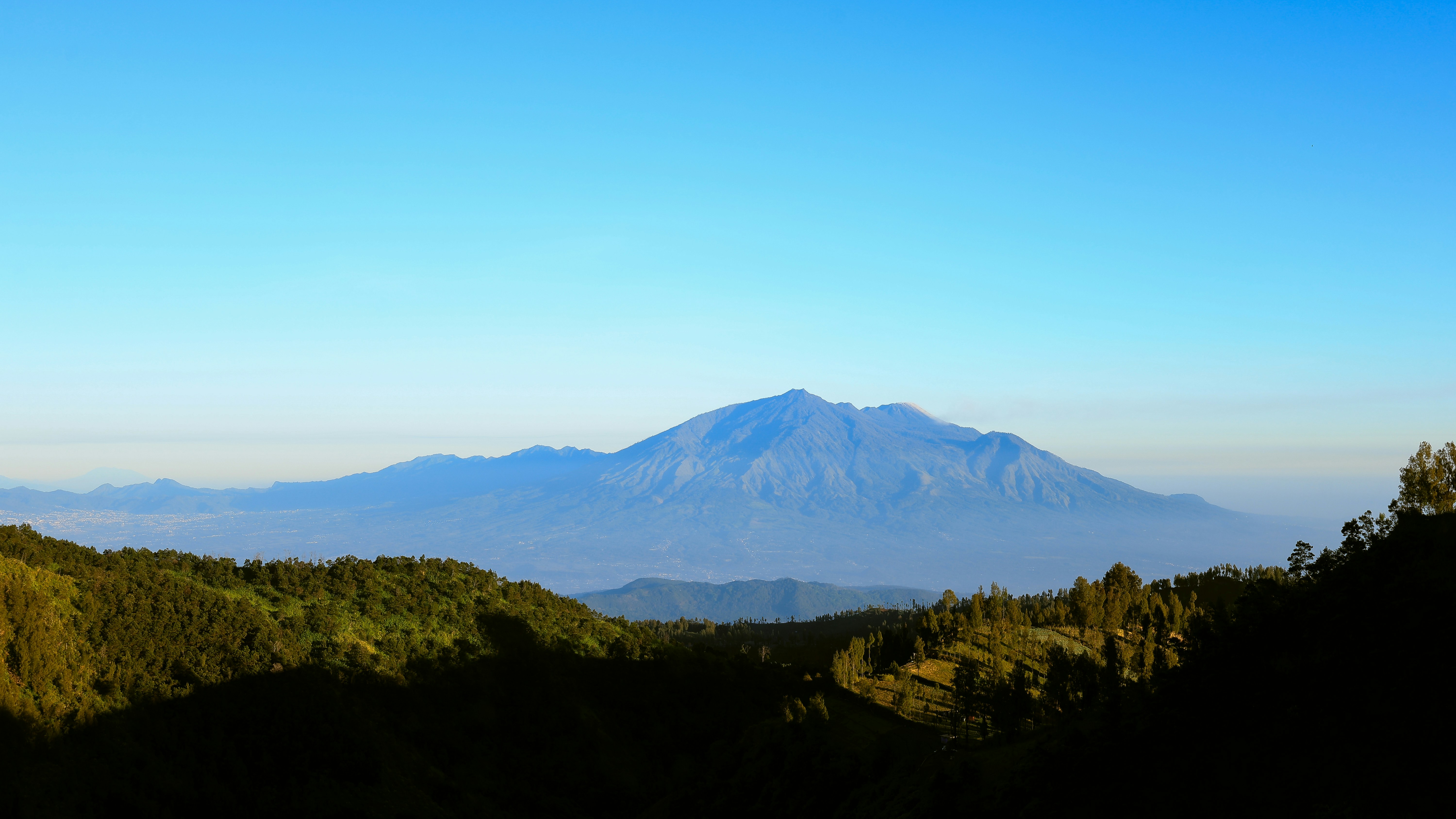Azure Summit: A Silent Ridge Beneath a Clear Sky