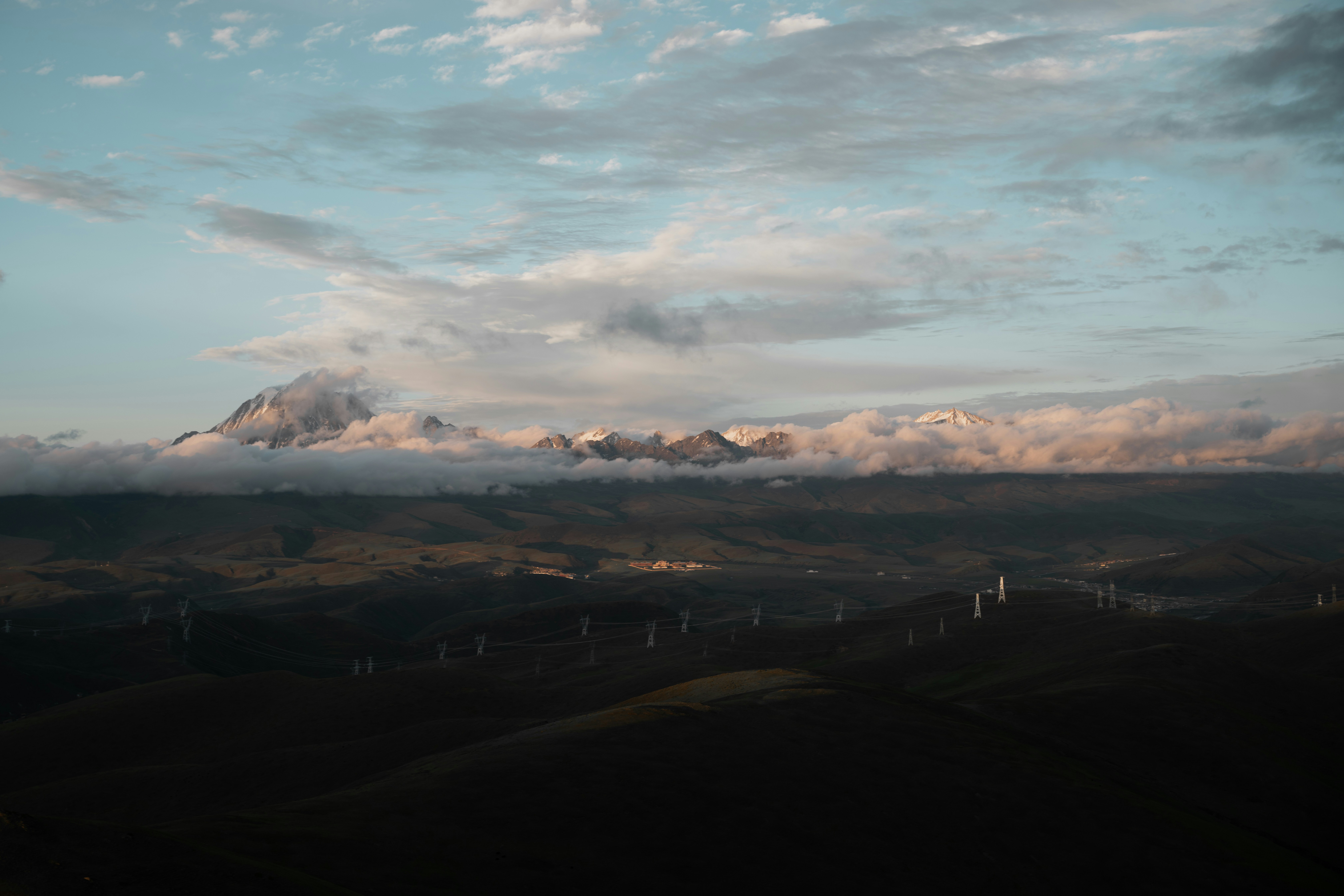 Horizon of Wind: Distant Peak Above Quiet Valleys