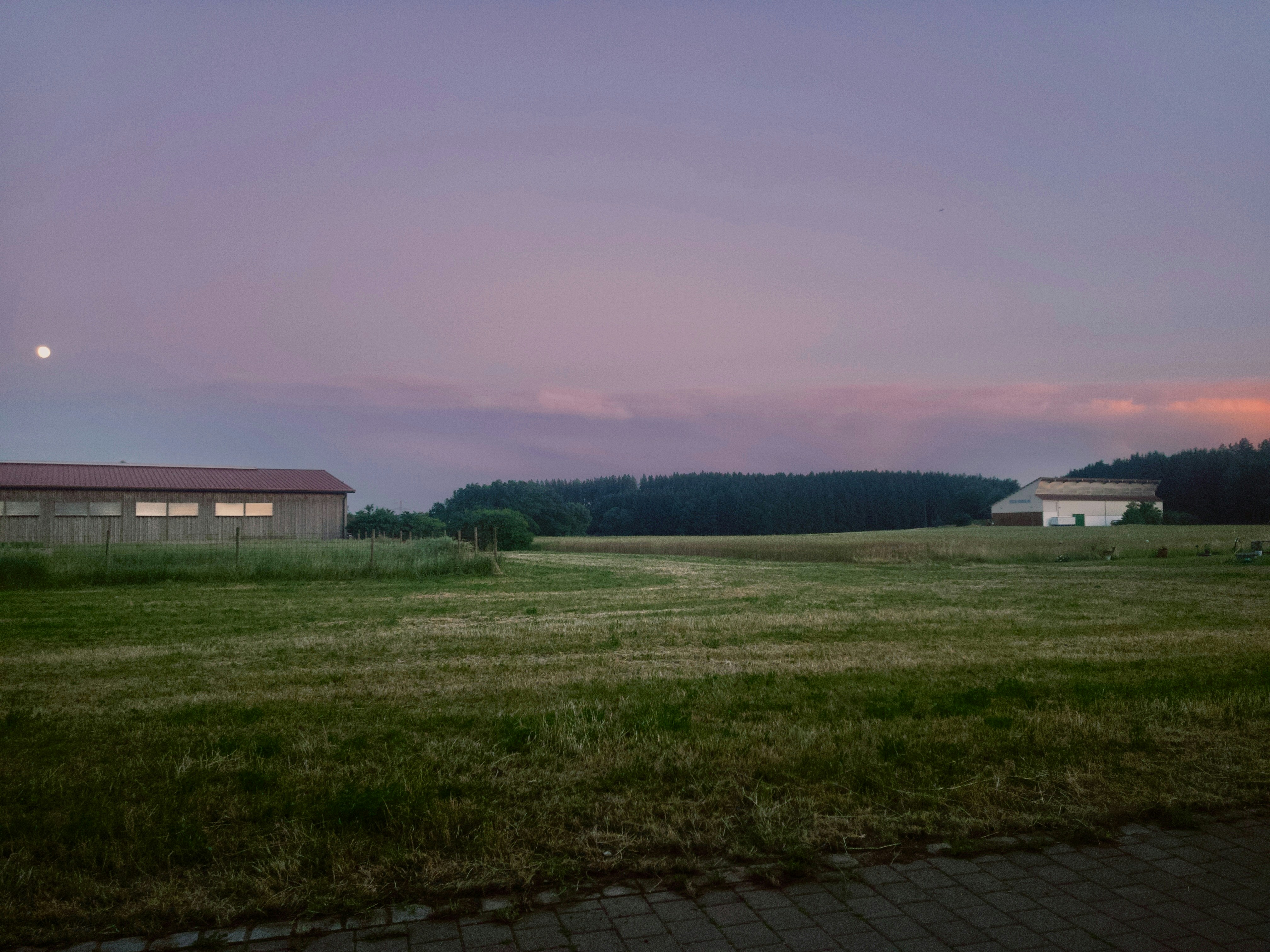 Moon over the Field: Dusk at the Quiet Airstrip