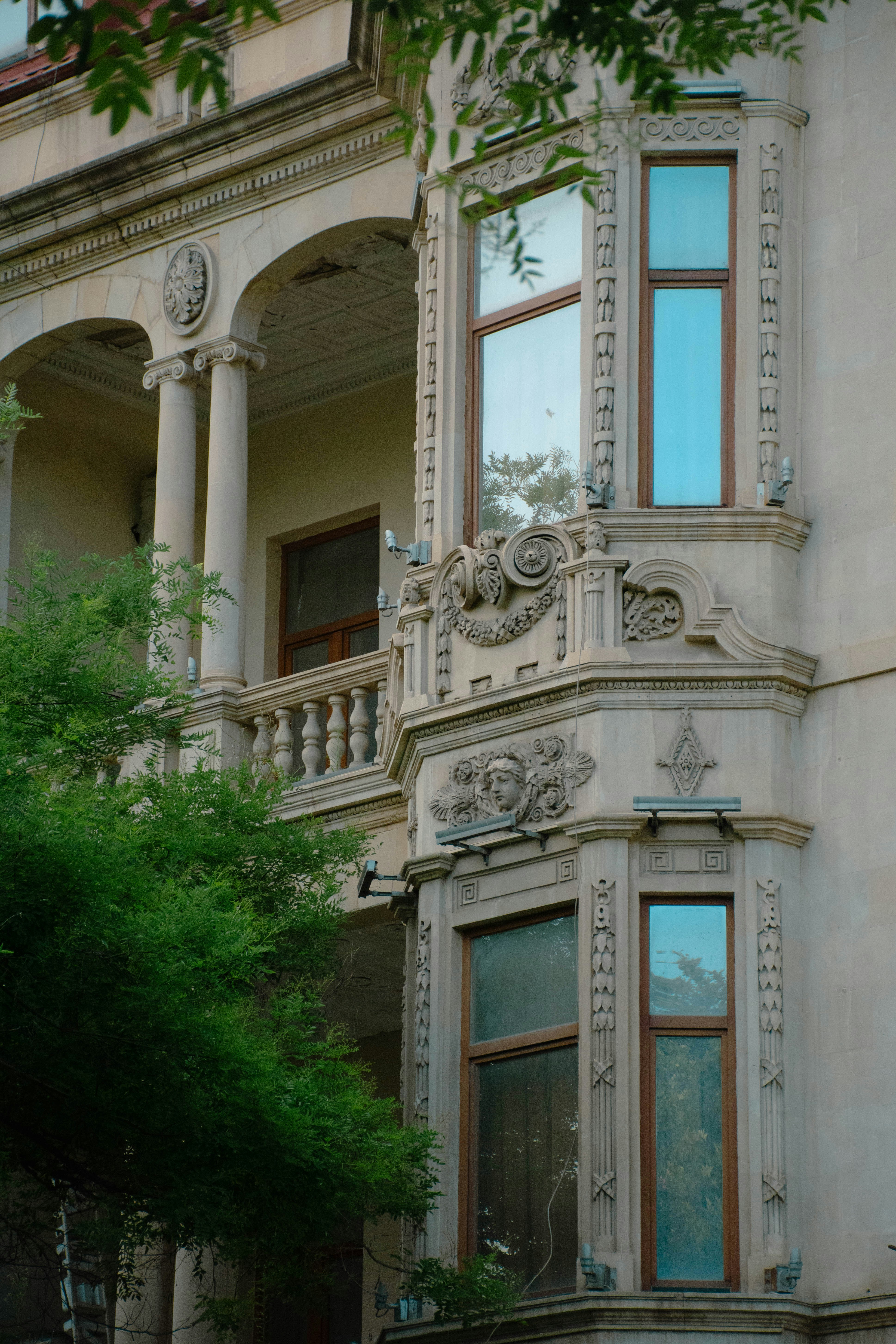 Ornate Corner Terrace: Carved Facade and Turret Windows