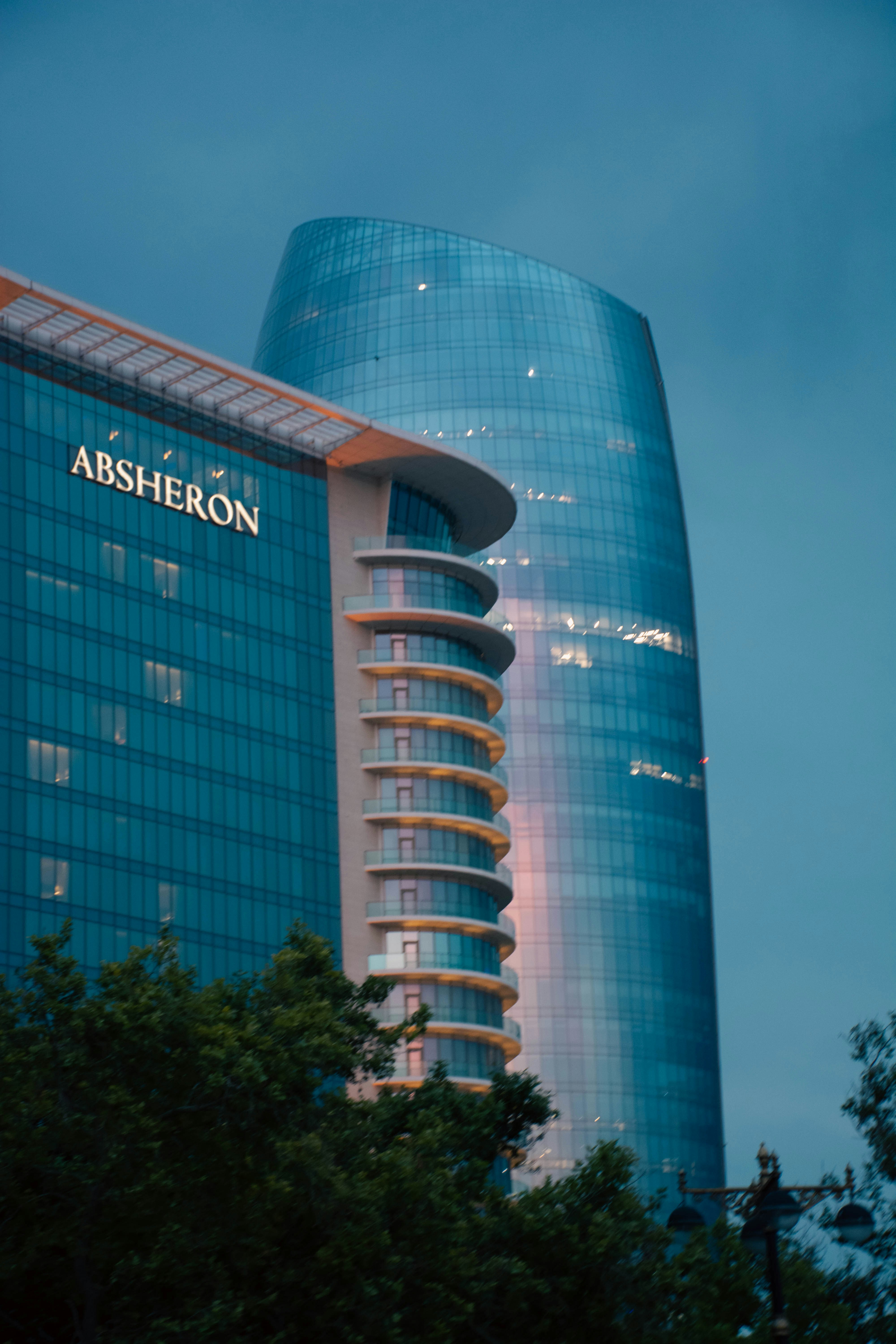 Glass Tower Rising: Absheron Curves Against a Dusk Sky