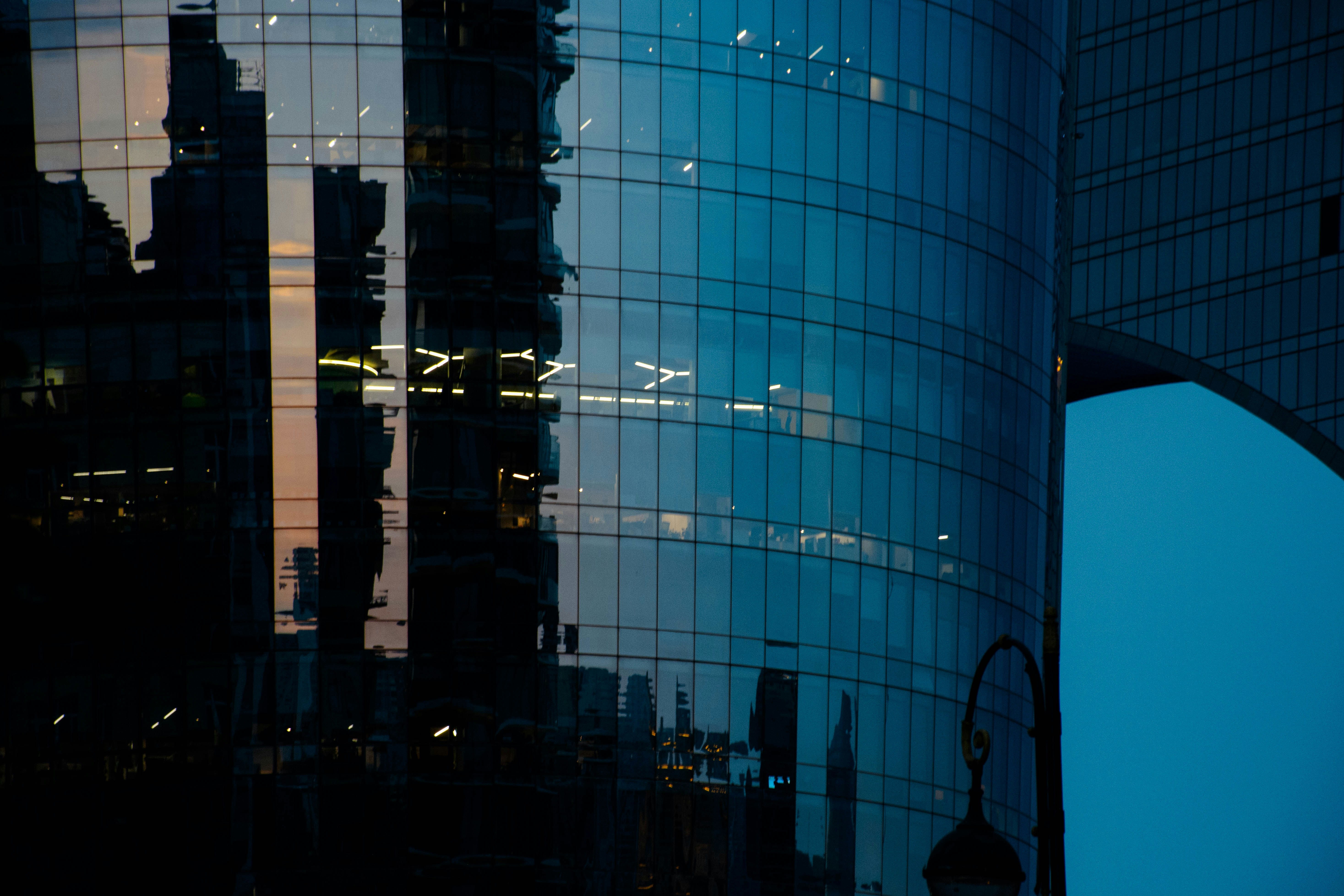 Glass Skyline Reflections at Dusk