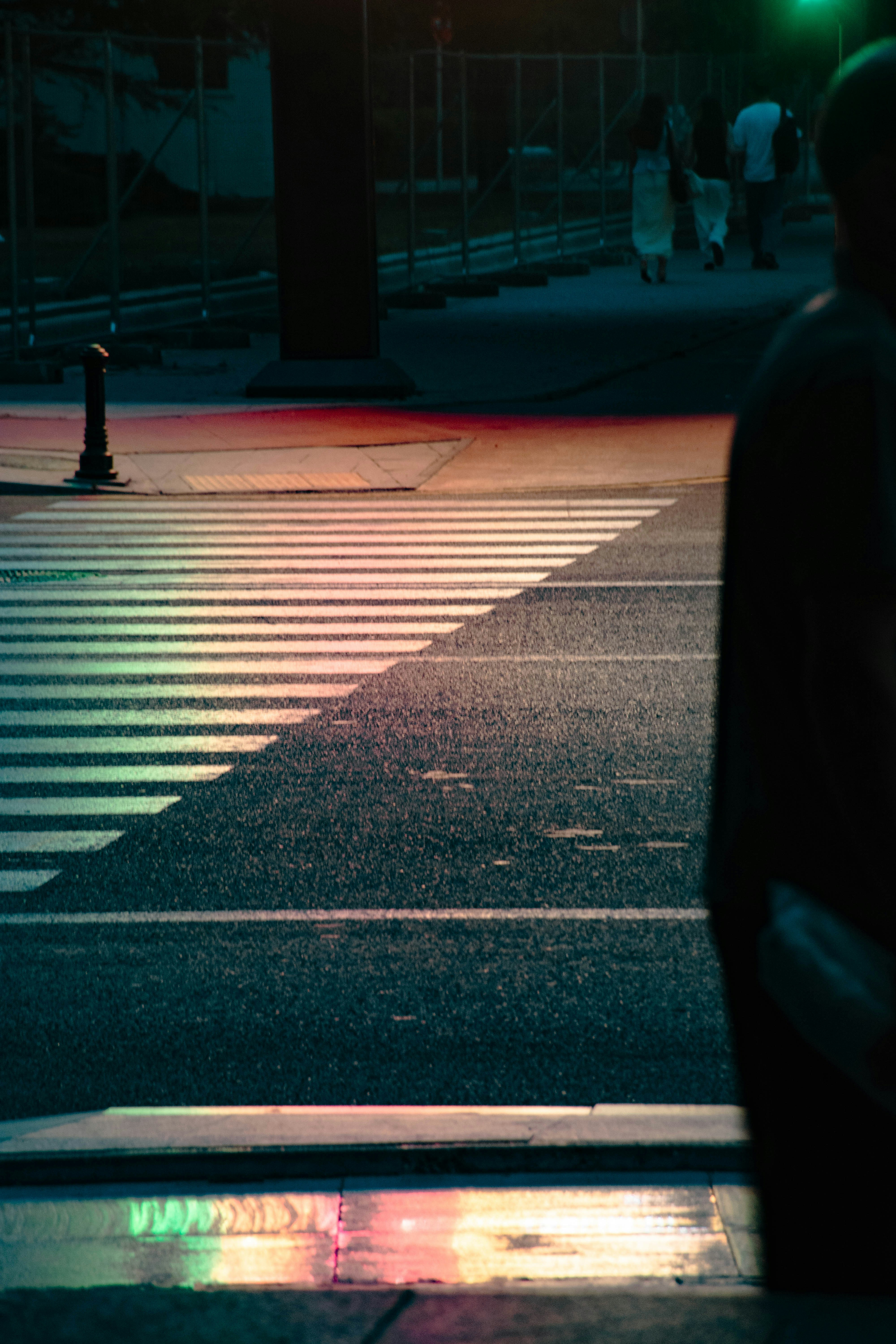 Neon Crosswalk Reflections at Dusk
