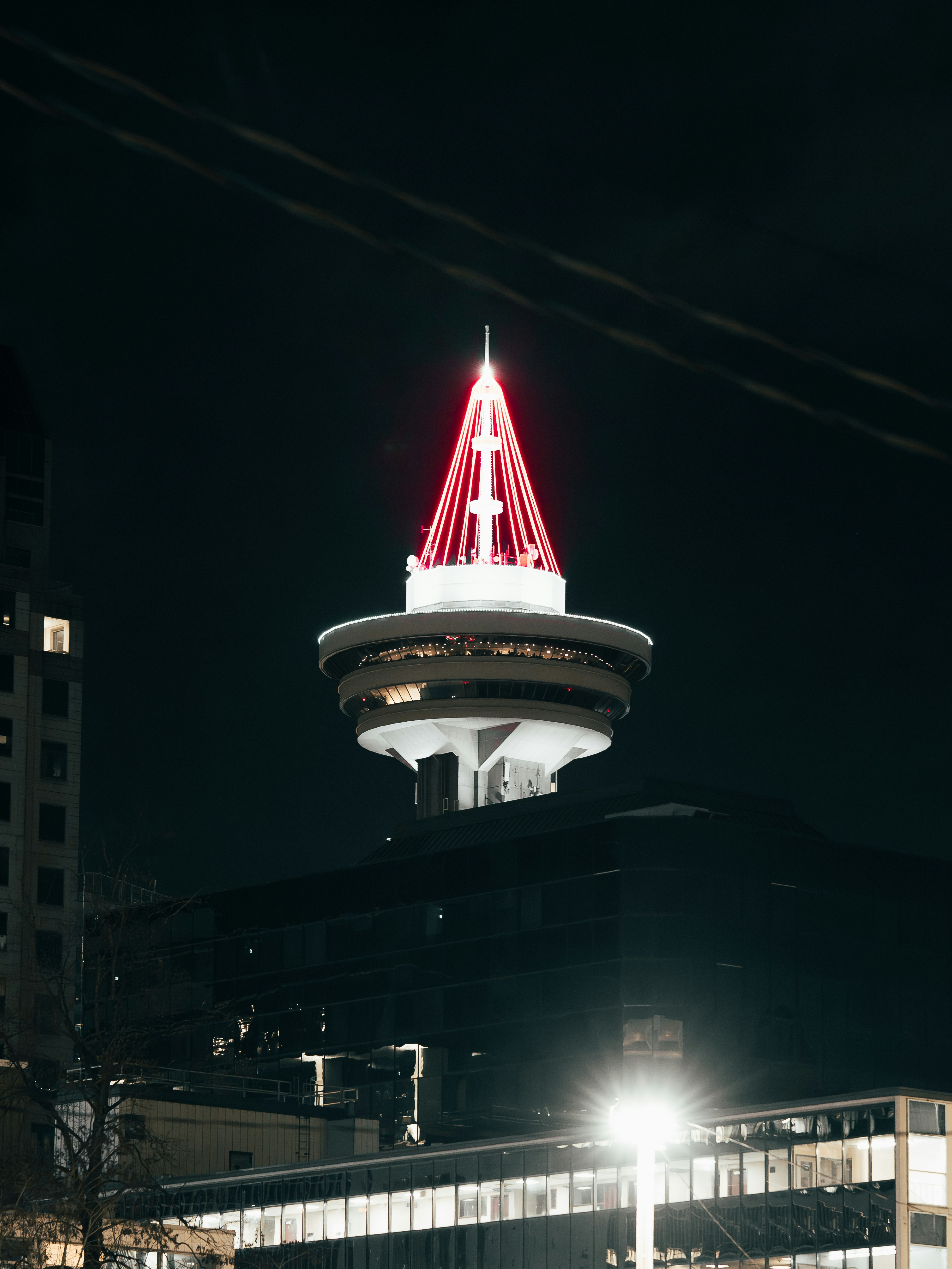 Neon Apex: The Tower's Red Crown over a Quiet Night