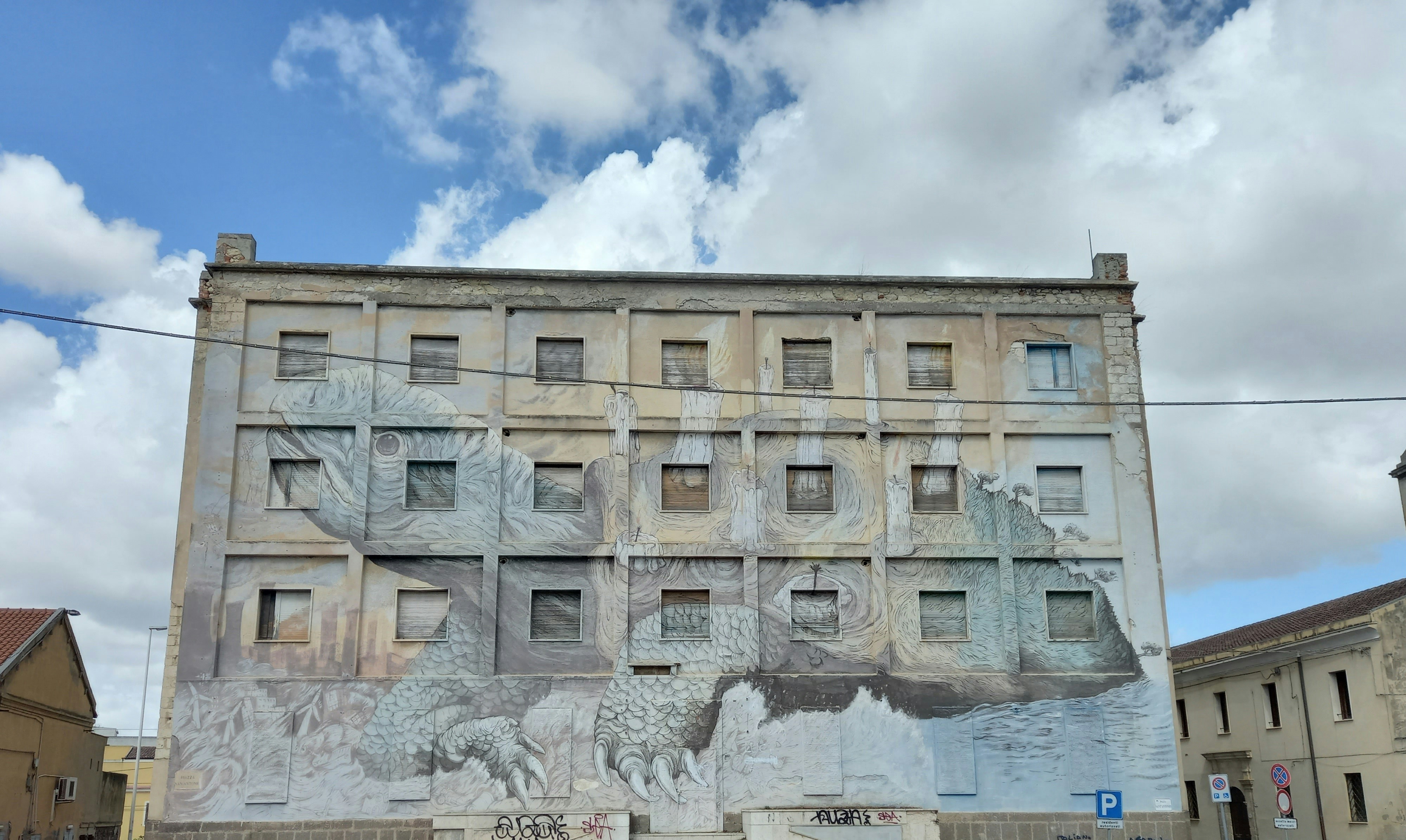 Muraled Facade: A Blocky Wall with Fading Scene Telling Time