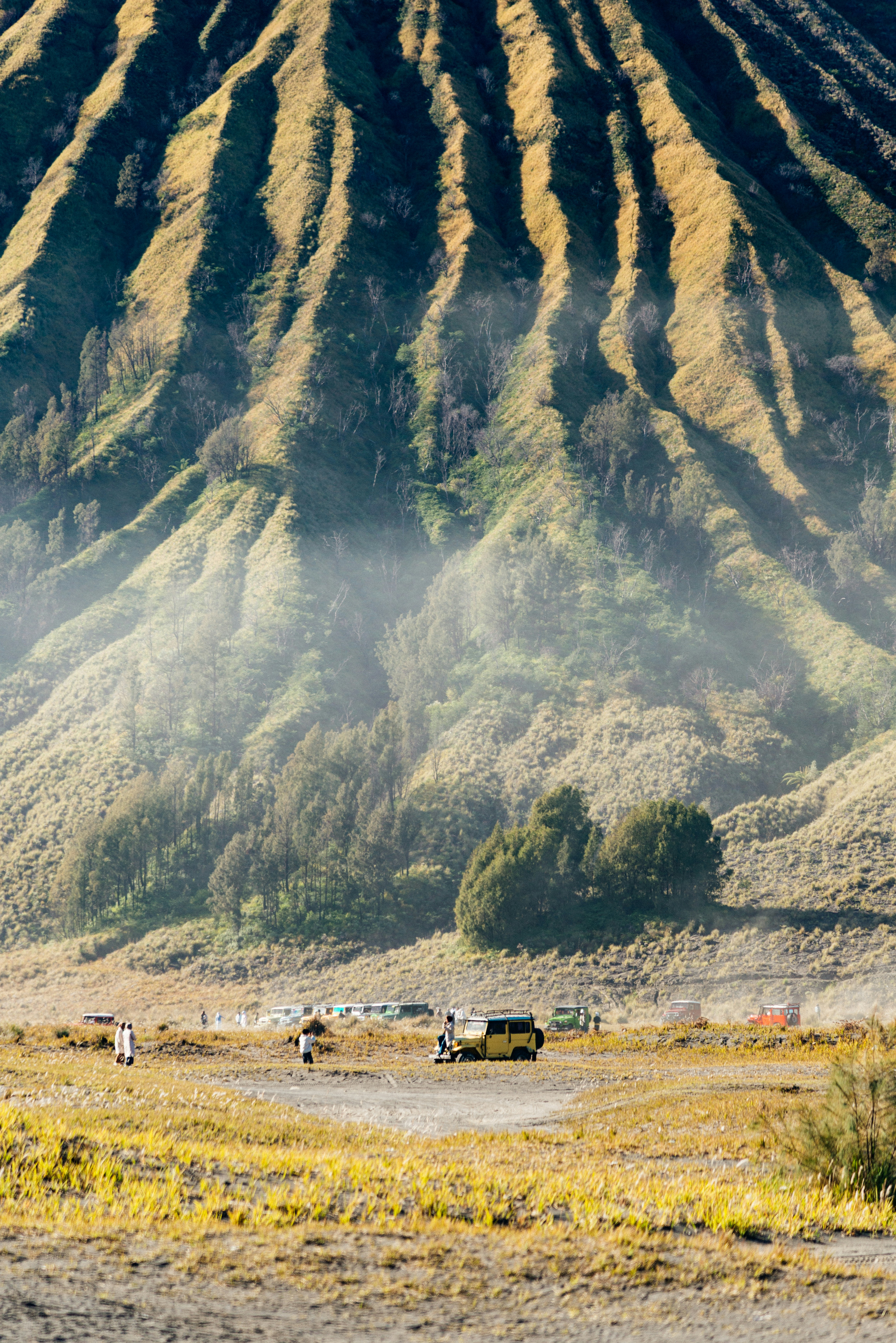 Mist on the Plains: Ground Crew at the Base of Rugged Hills