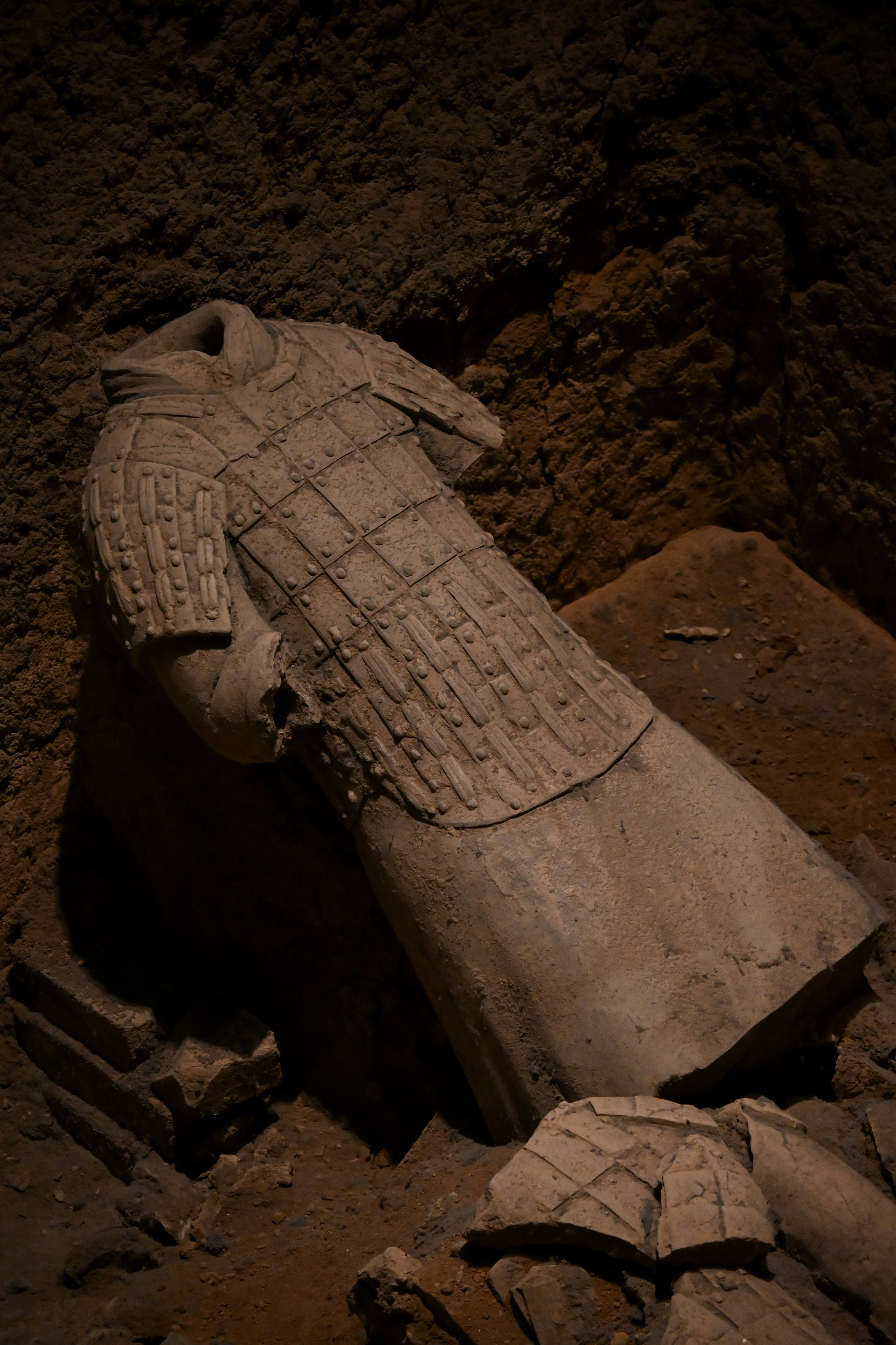 Ruins of a Prominent Armored Statue Half-Buried in Red Earth