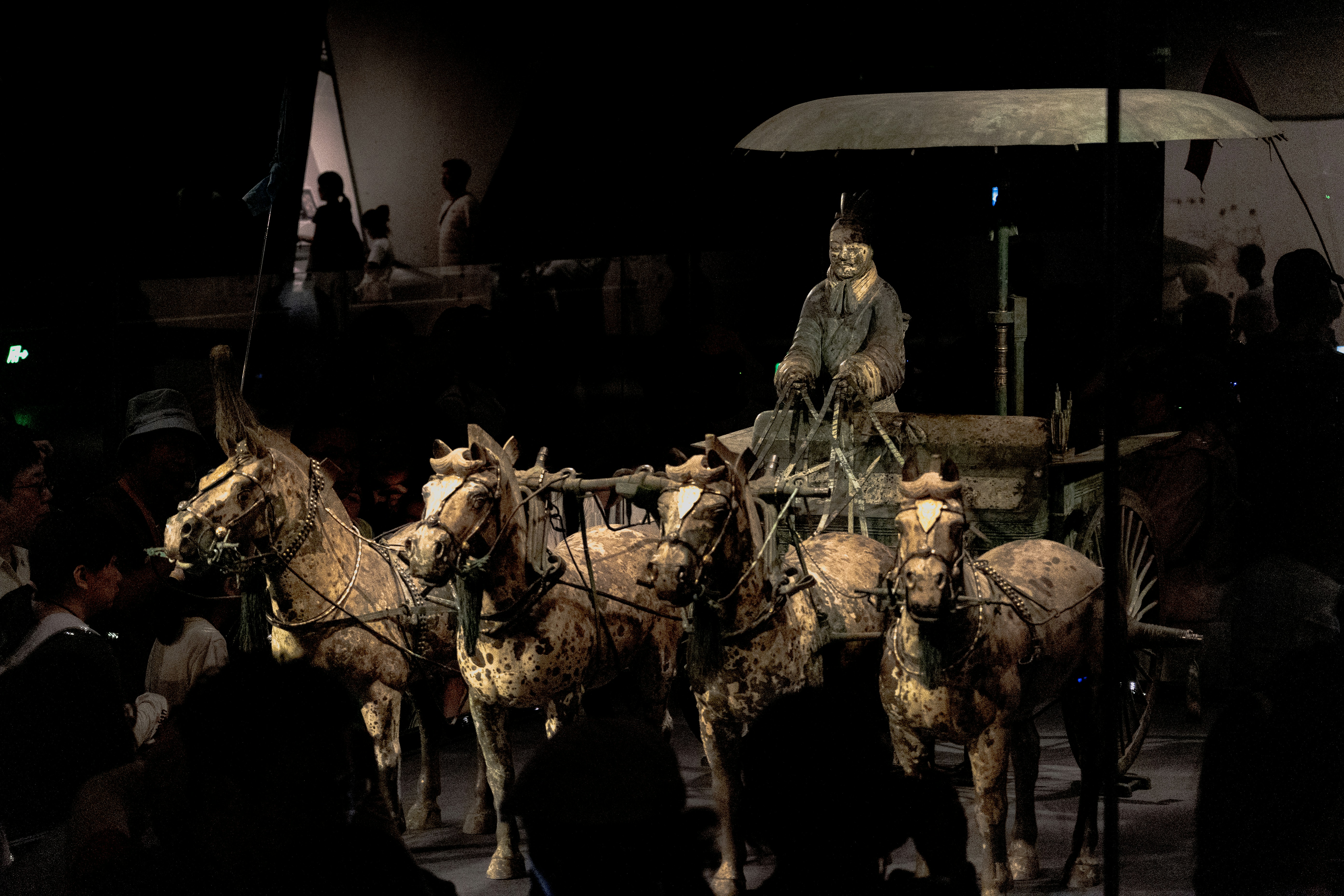 Emperor’s Parade: A Regal Carriage Amid Silent Warriors