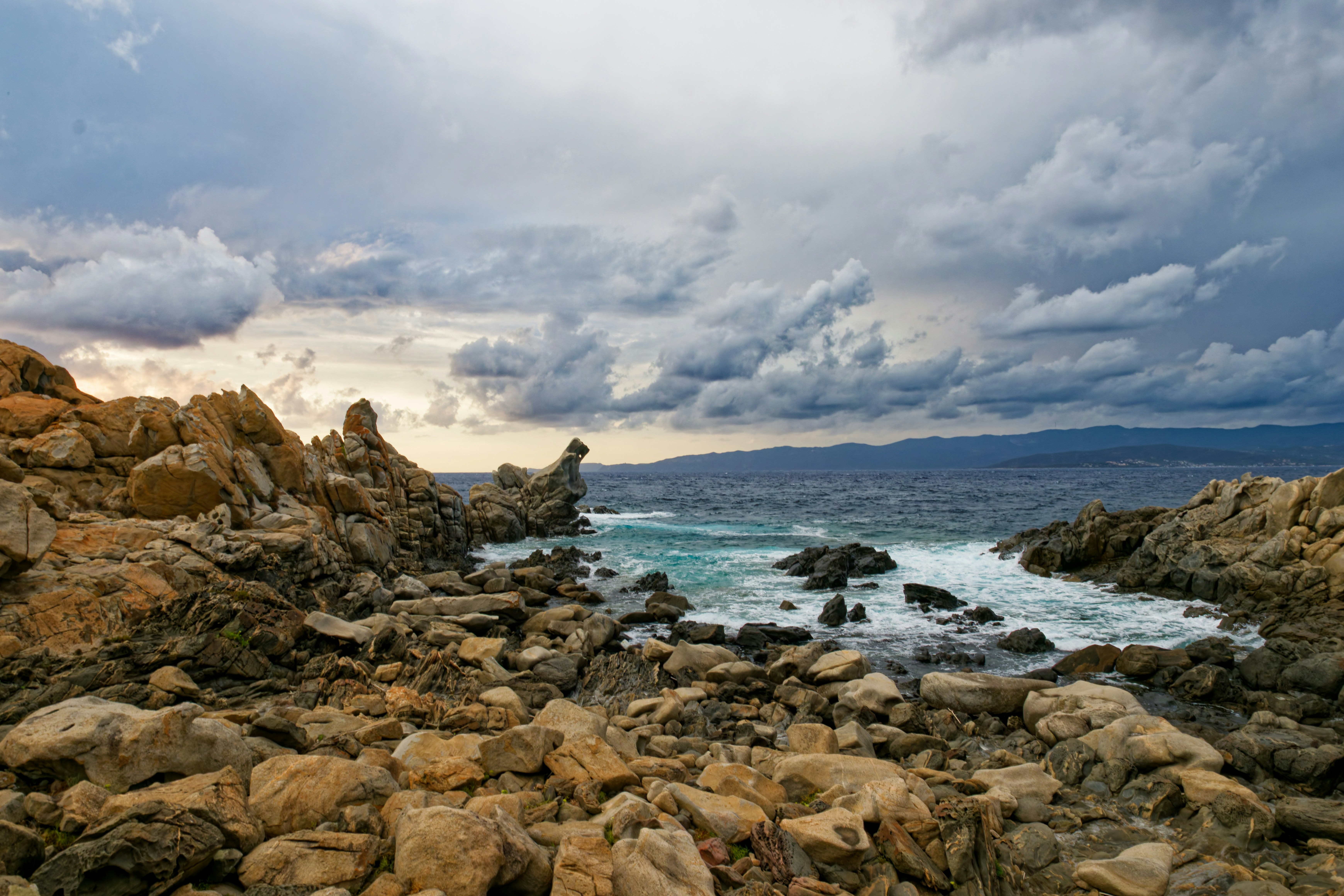 Rugged coastal granite under dramatic skies