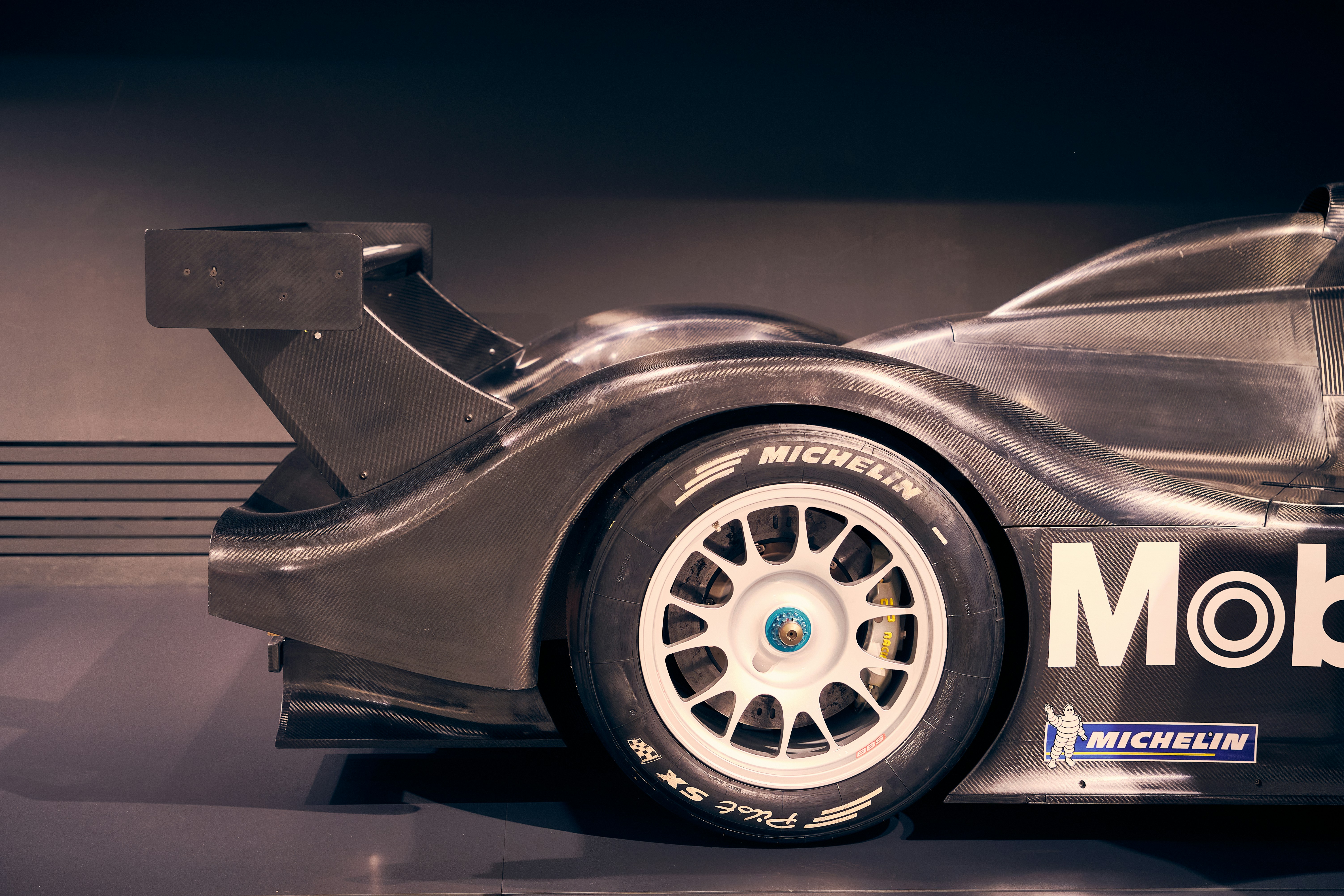 Rear Wing and Wheel: A Closer Look at a Peugeot–styled Racing Car