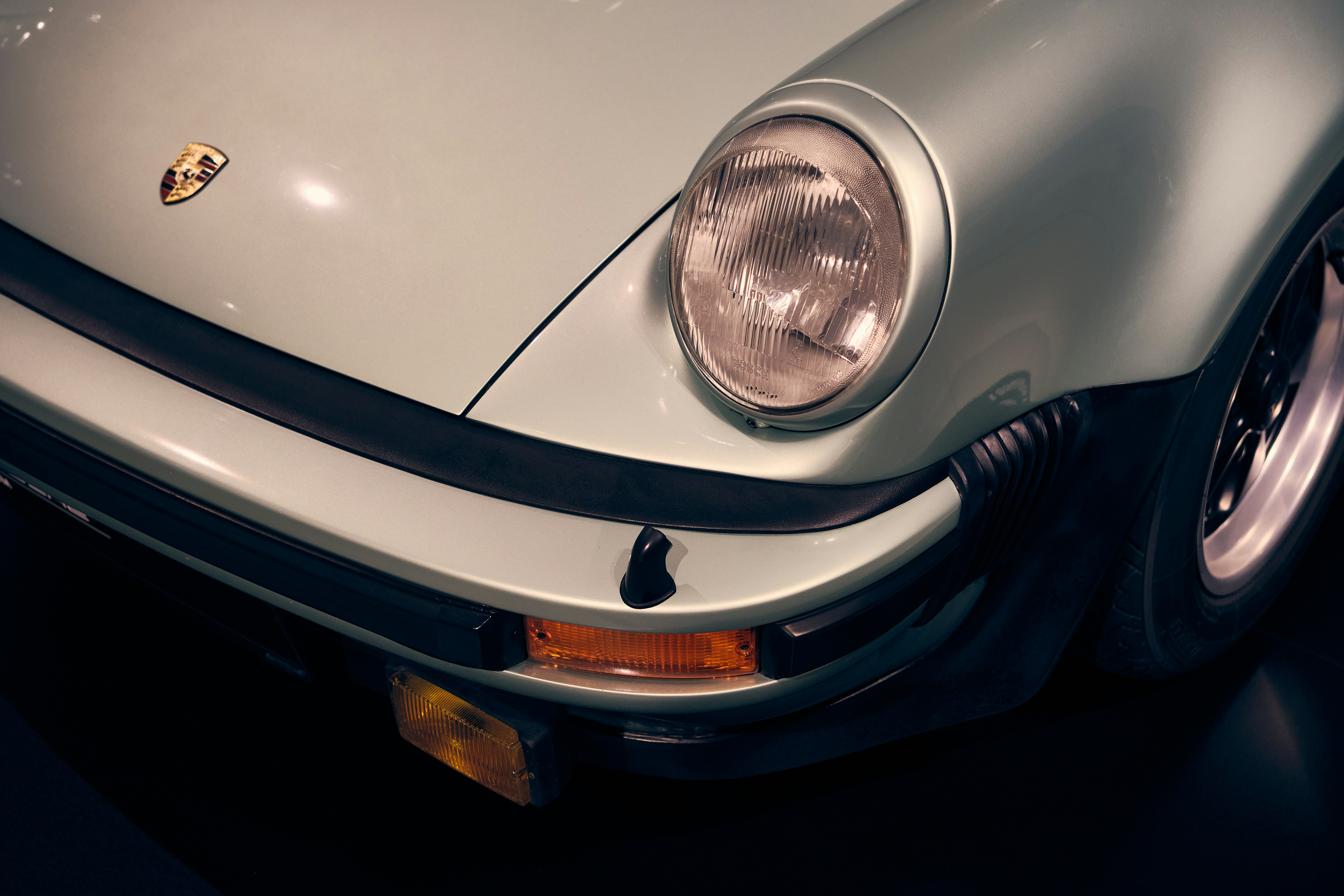 Pastel Porsche Curves: A Close-Up of a Classic Front Corner