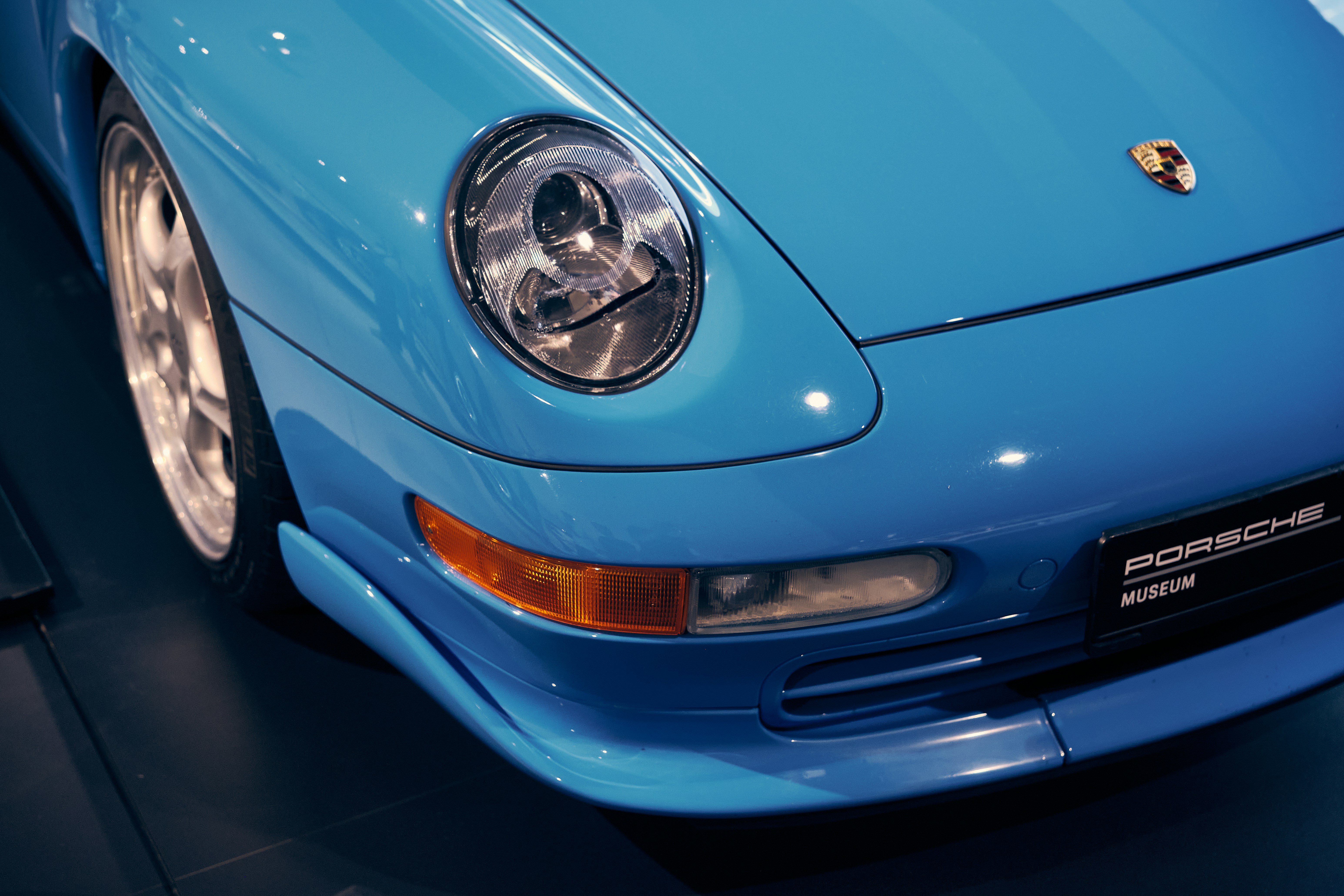 Blue Porsche Studio Stare: Front Corner in Focus