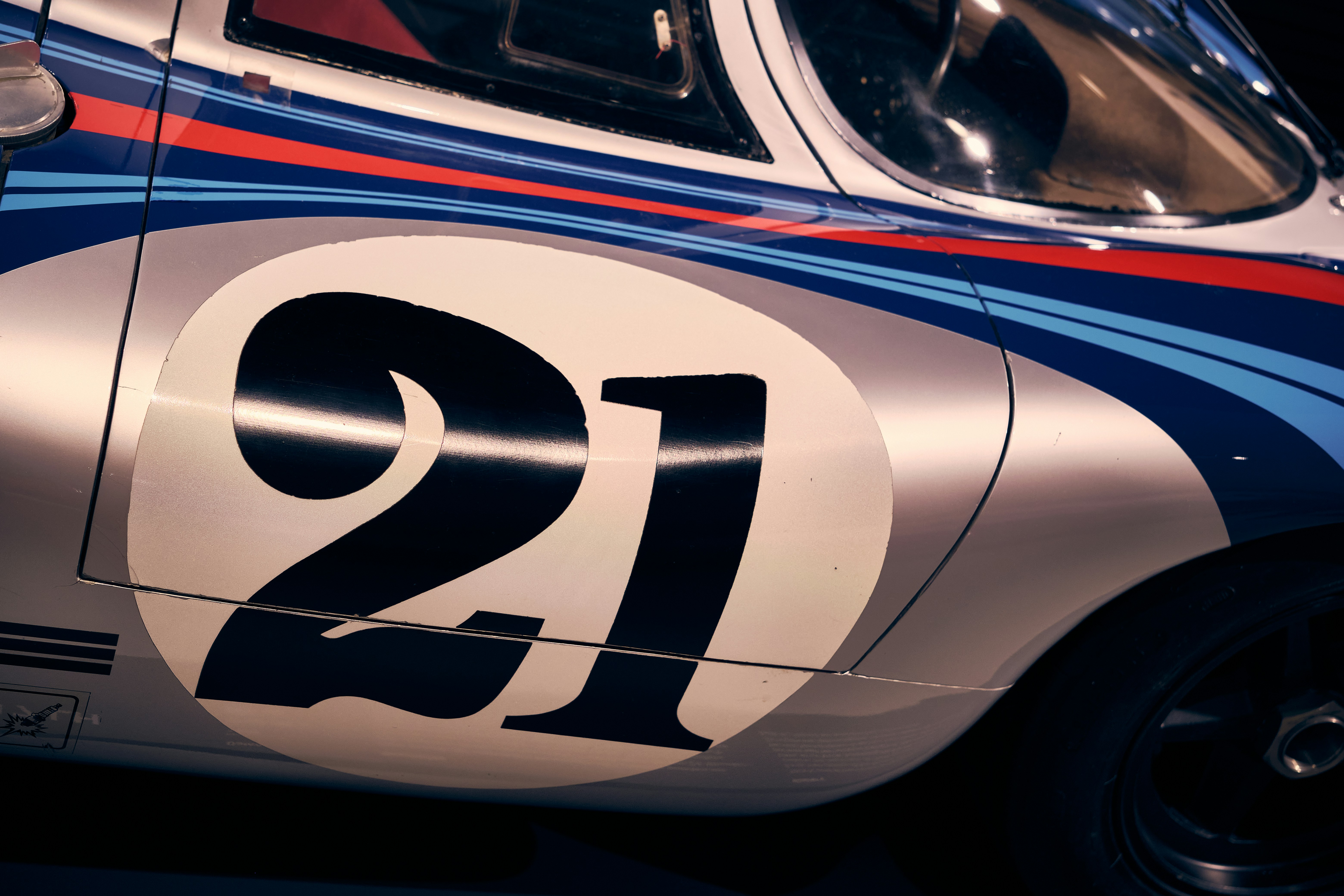 Number Twenty-One: A Racing Car's Bold Emblem in Motion