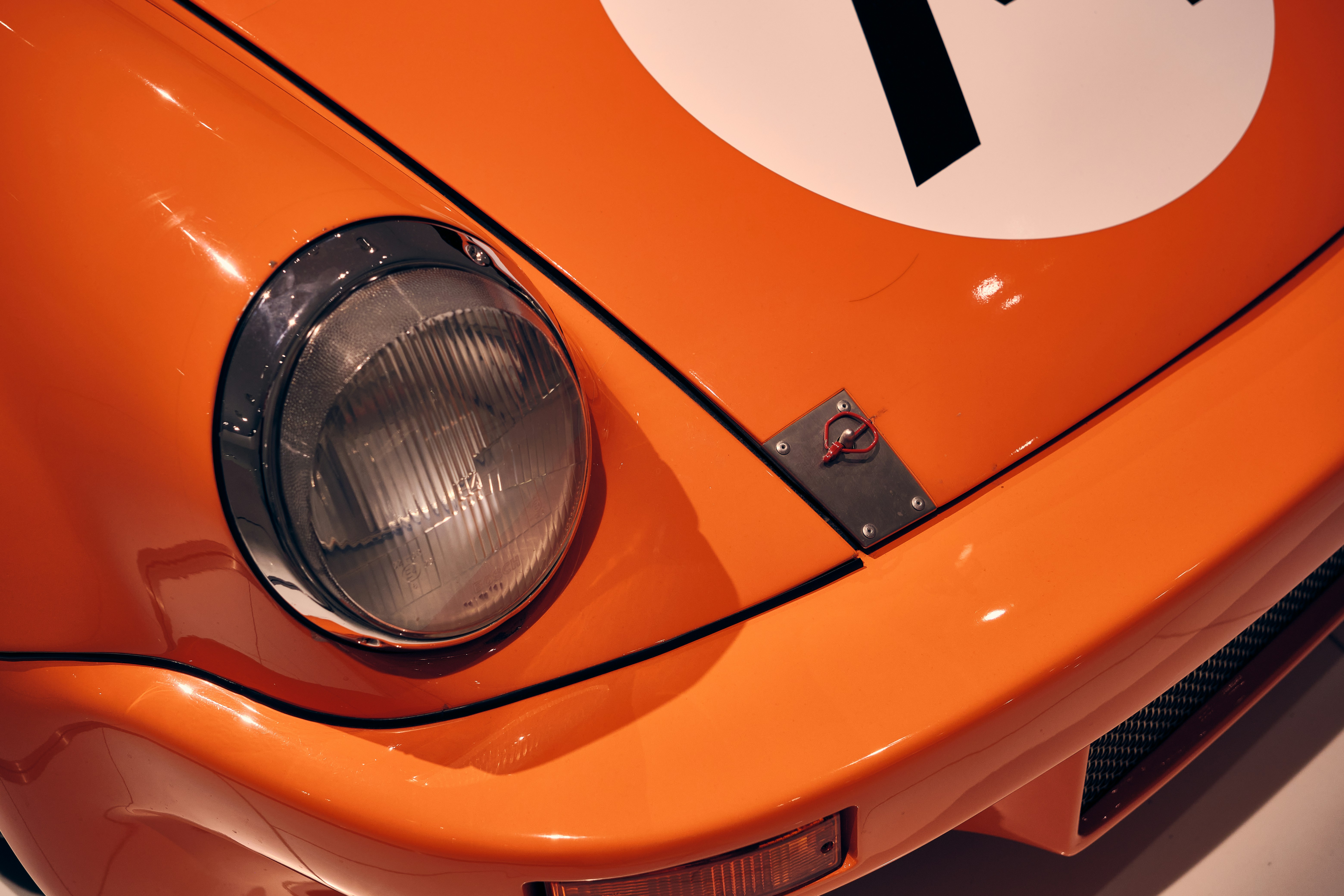 Orange Porsche-esque Curves: A Bold Front Quarter Shout