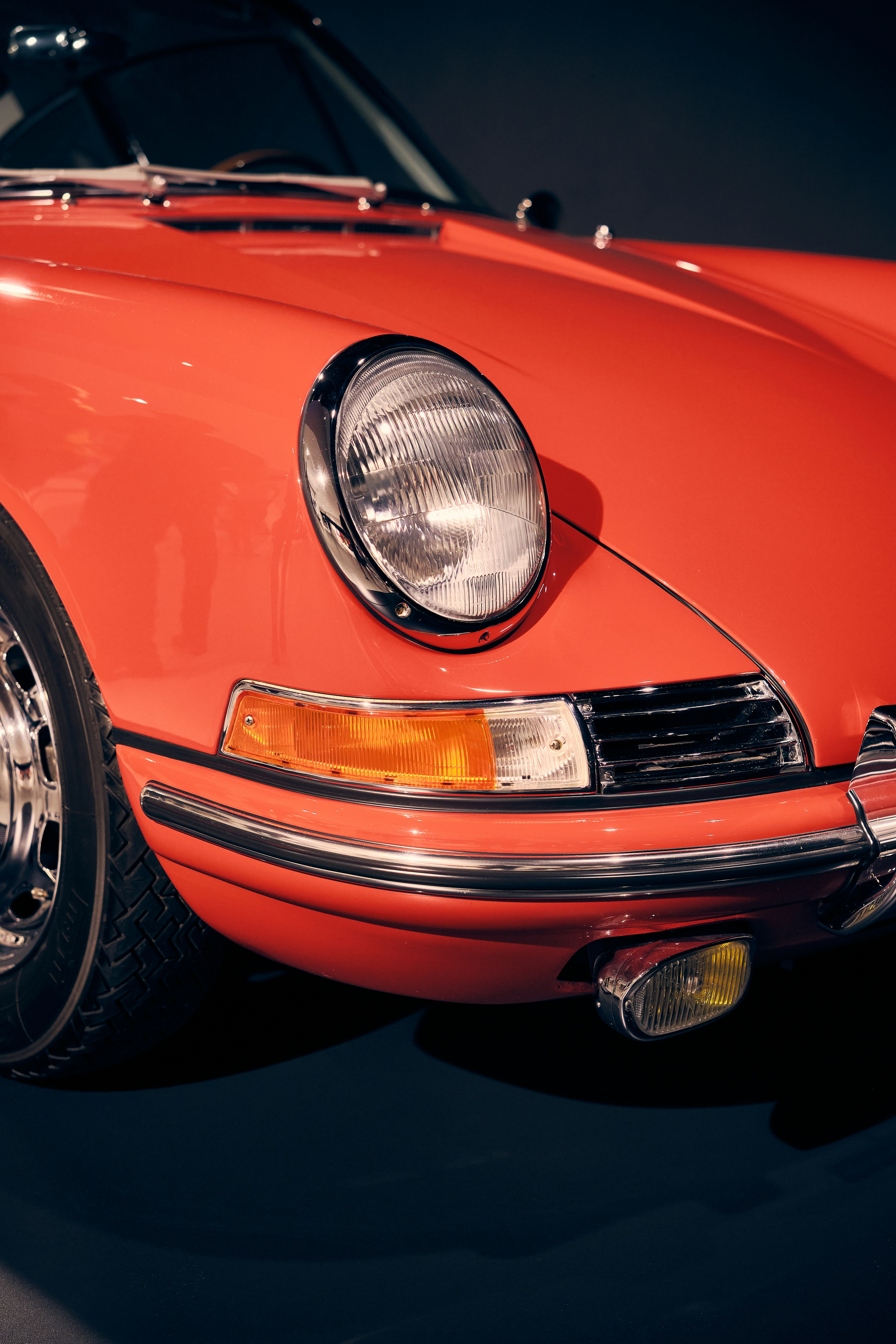 Red Porsche Glow: A Classic Headlight in Focus