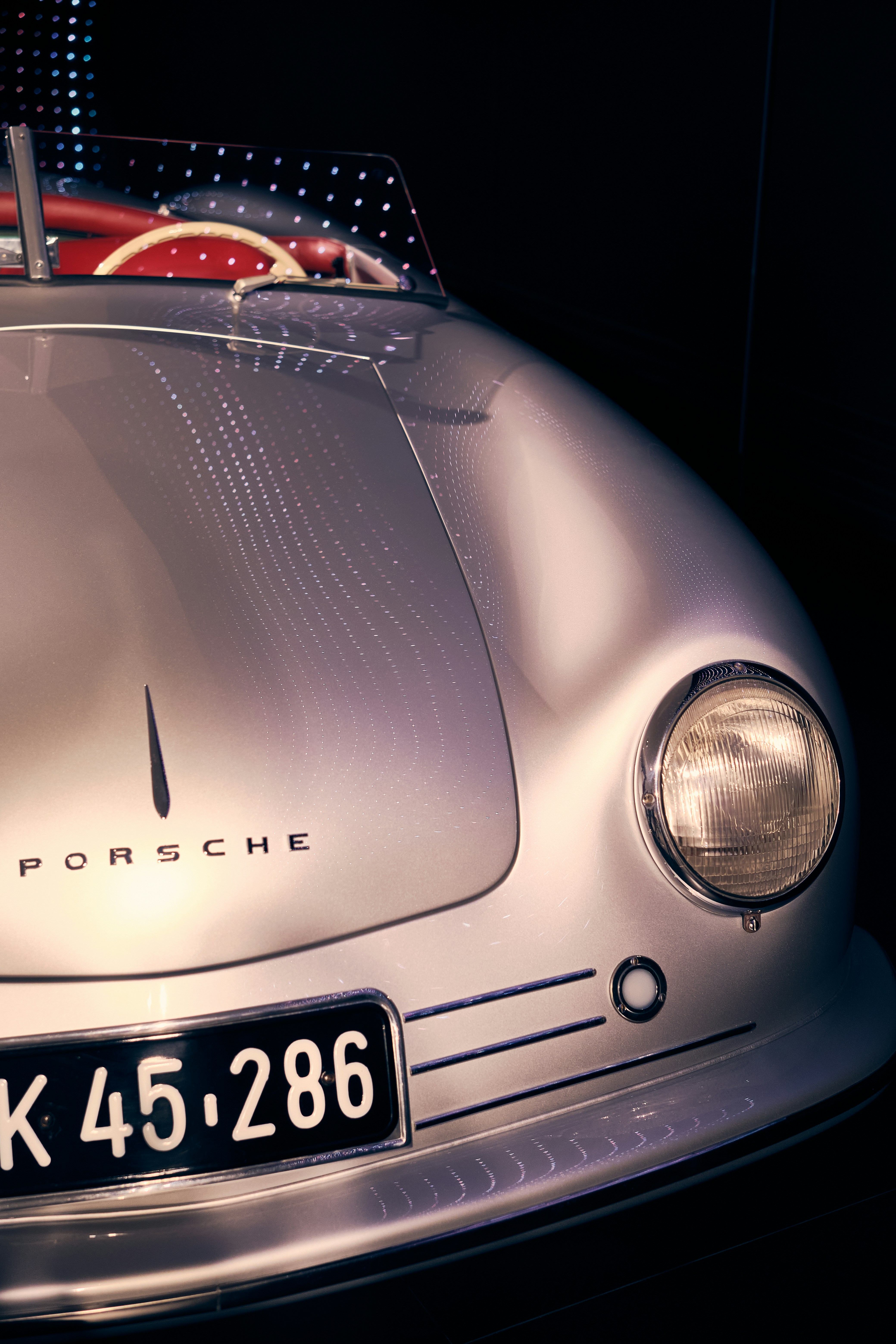 Silver Classic: A Porsche Face Illuminated by Neon Dots