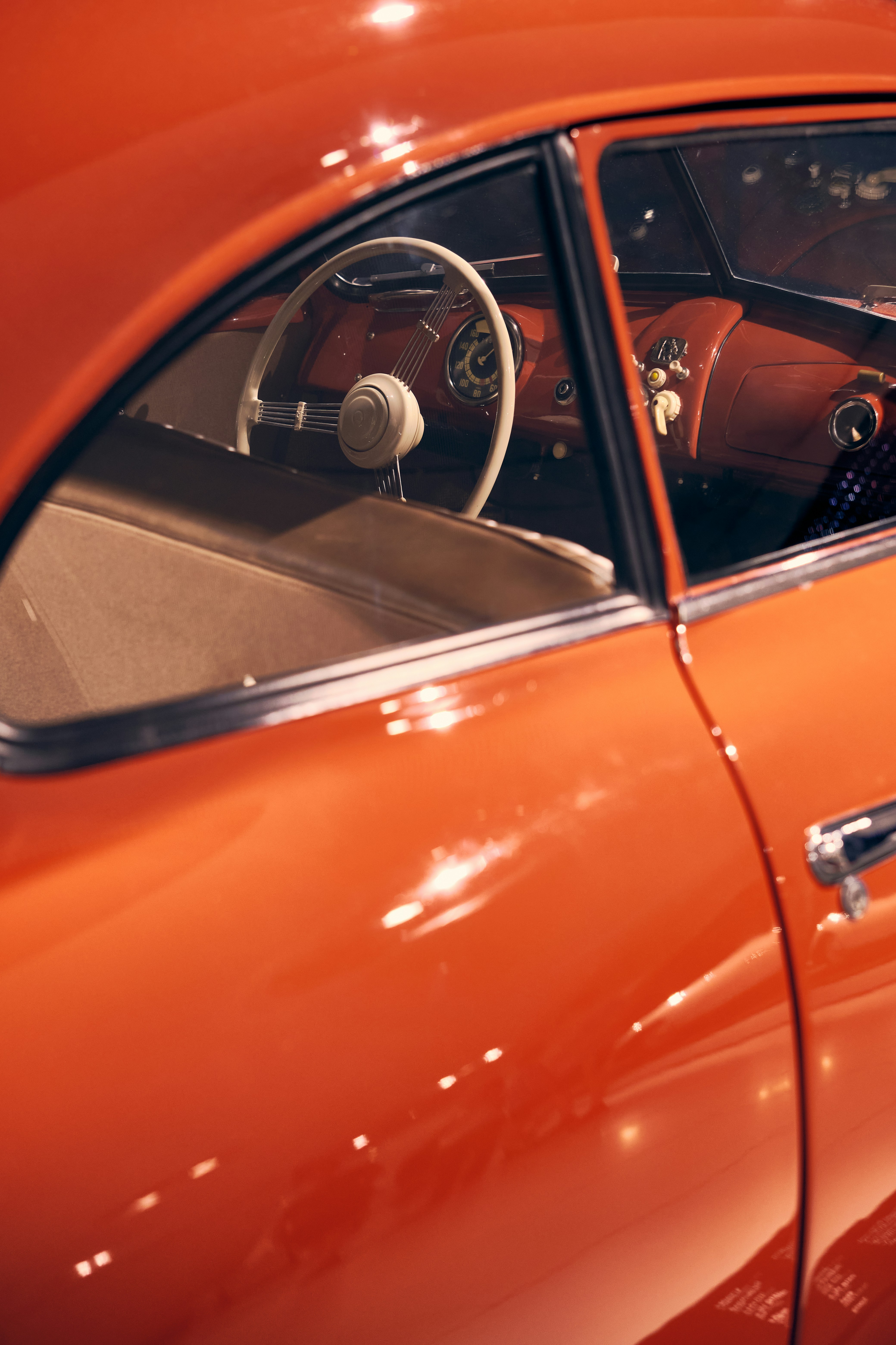Orange Classic: The Vintage Cockpit Through a Car Window