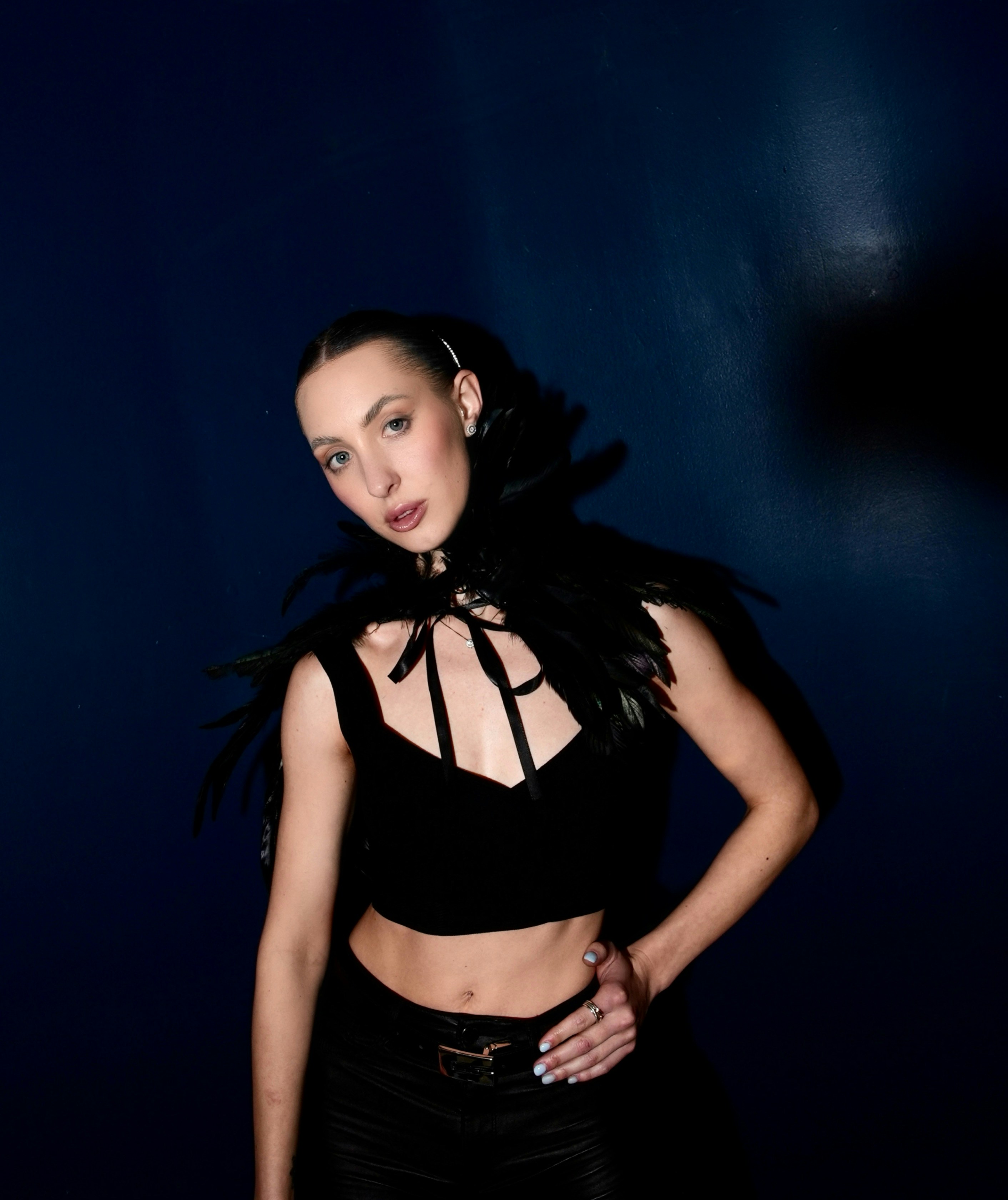 Velvet Night: The Poised Gaze Beneath Feathered Fringes