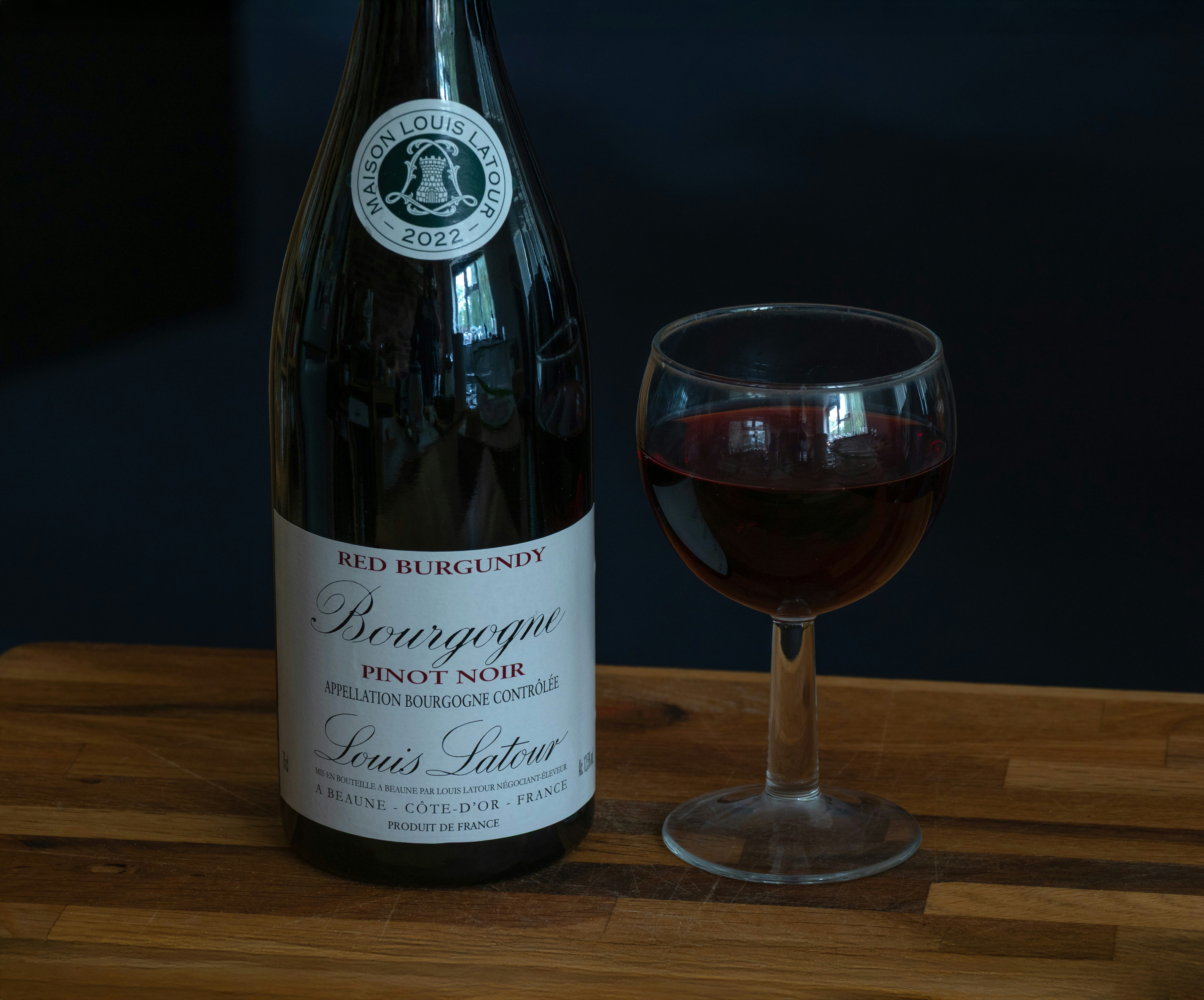 Red Burgundy Still Life: A Bottle of Pinot Noir and a Glass of Wine
