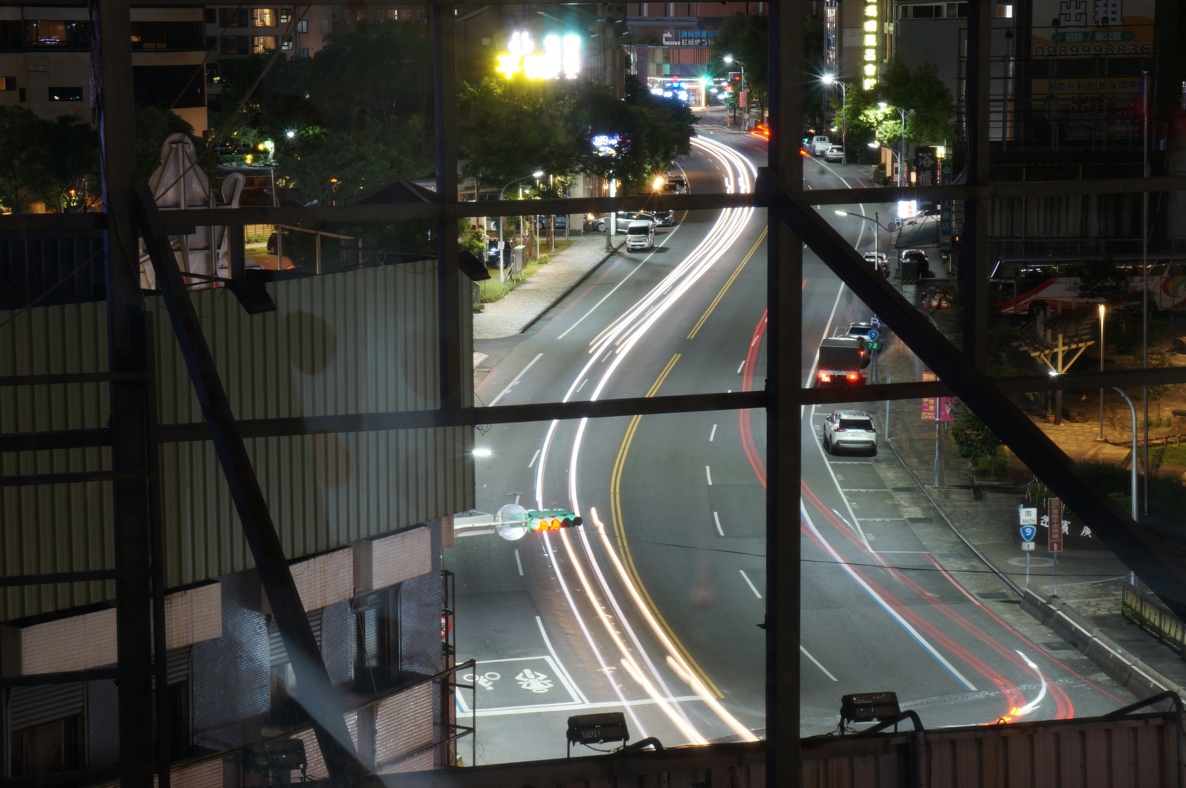 Night Corridor: Light Trails through a Framed City Street