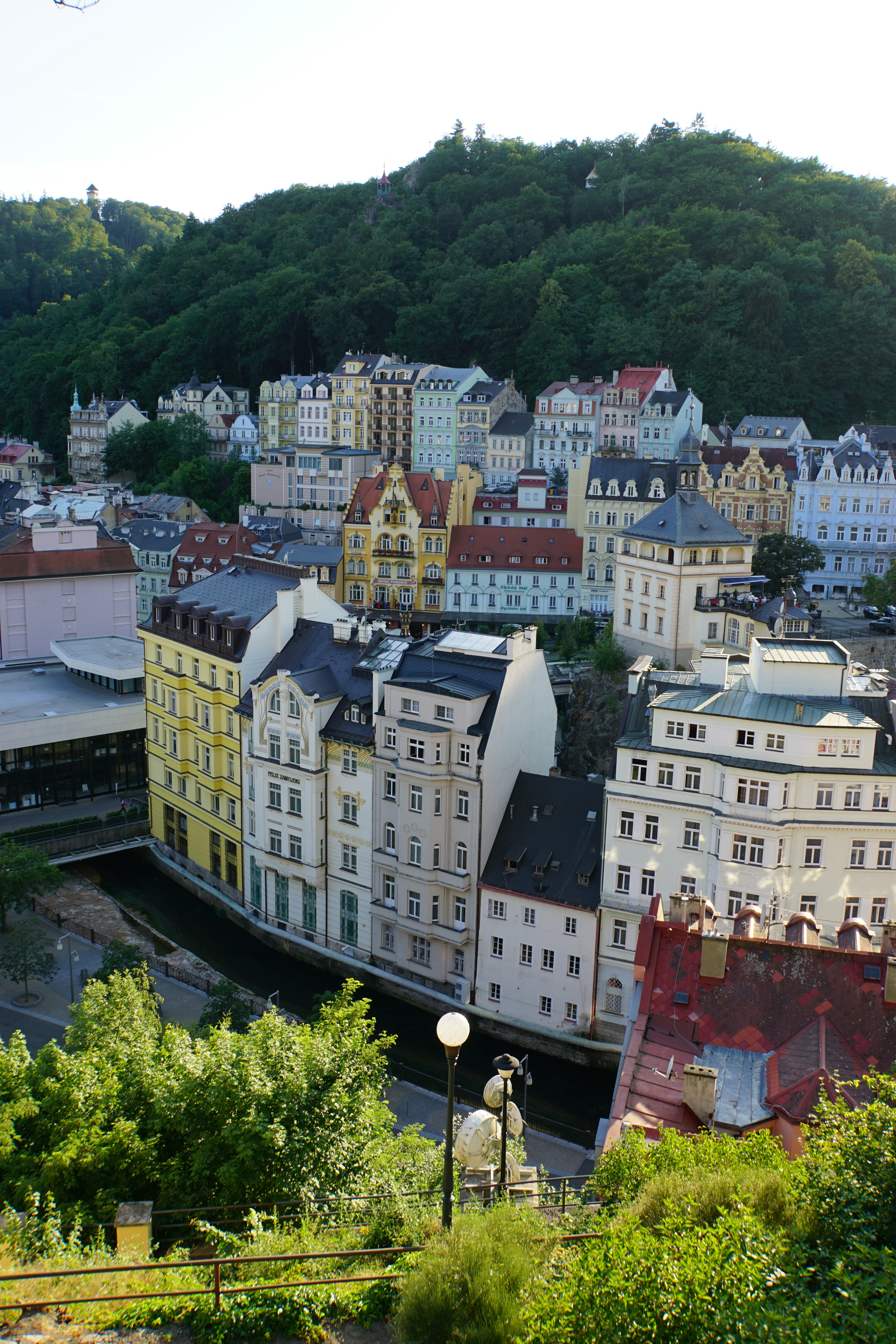 Colorful hillside Courtyard: A Village of Painted Facades Sofely Nestled by Verdant Slopes