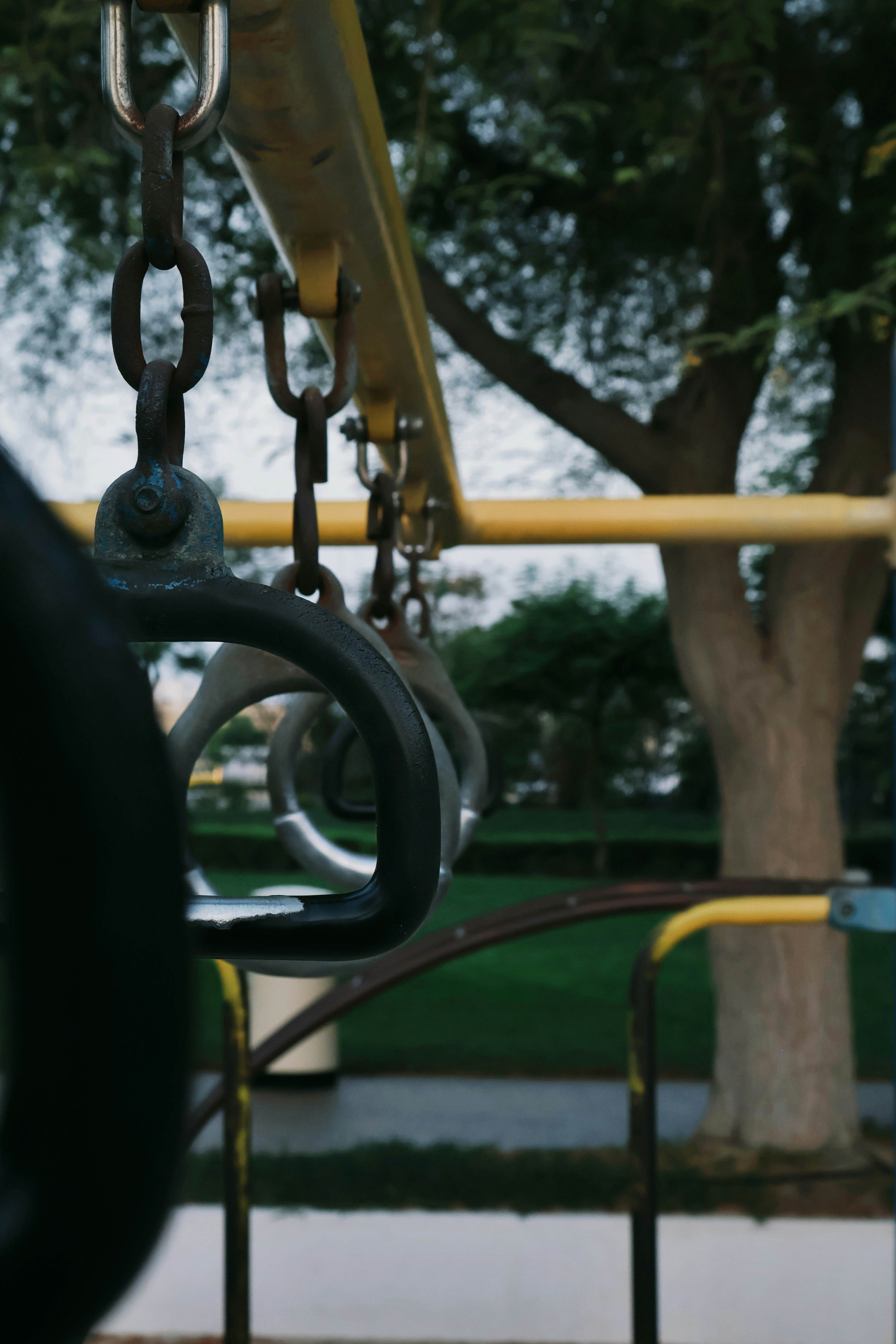 Suspended Rings: A Quiet Moment Under the Playground Beams